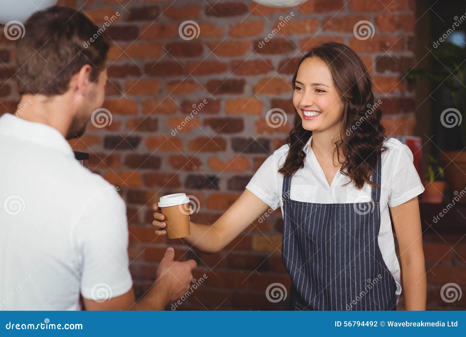 Pretty Smiling Barista Serving a Customer Stock Photo - Image of male ...