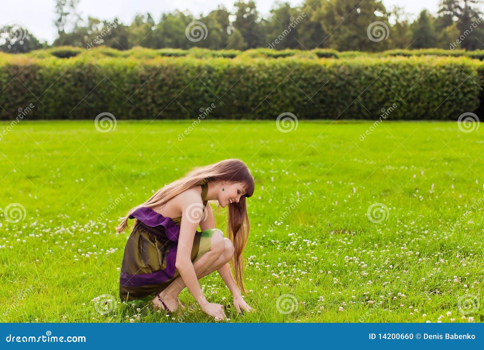 Pretty Smiling Girl is Search Something Stock Photo - Image of green ...