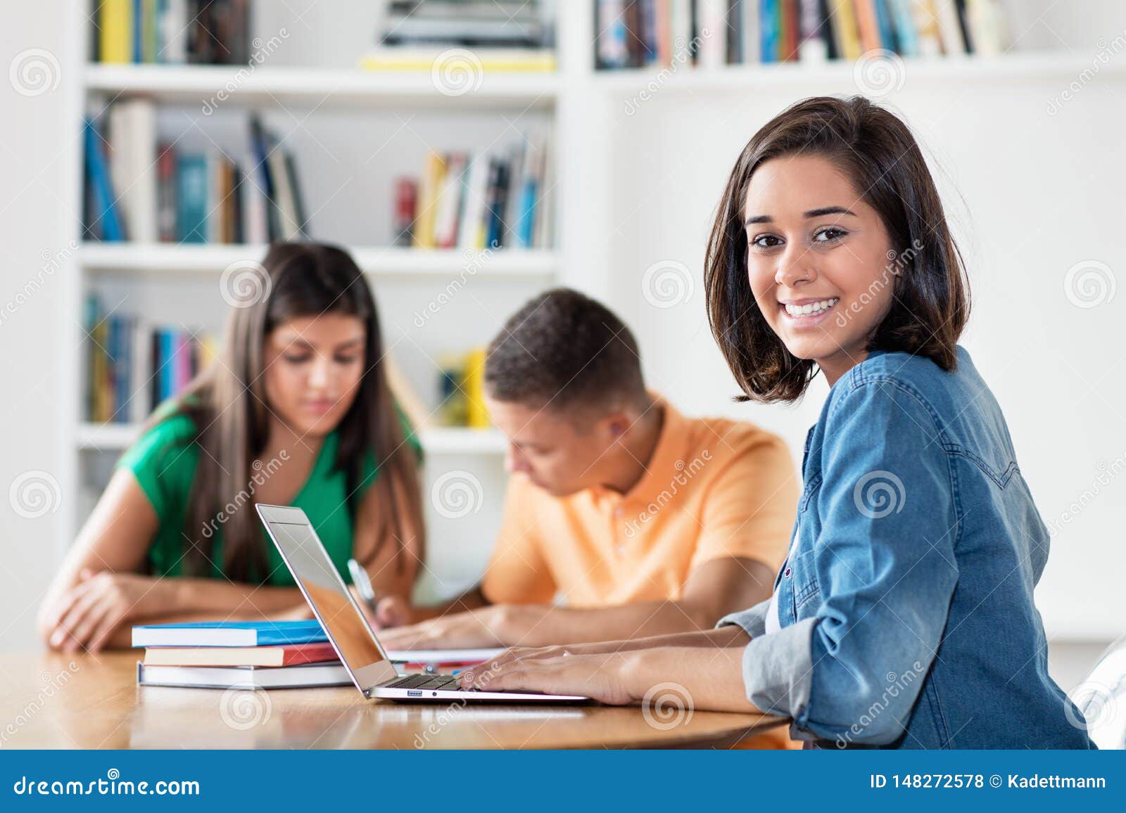 Pretty Spanish Female Student with Group of Learning Students Stock ...