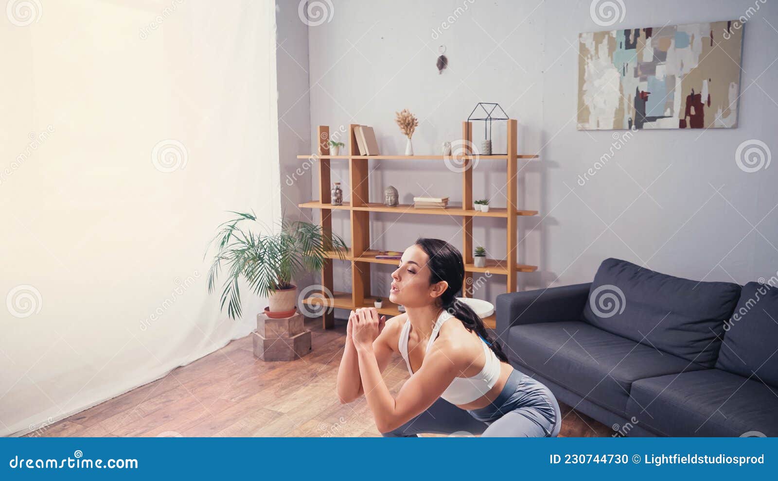 Pretty Sportswoman Doing Squat at Home. Stock Photo - Image of brunette ...