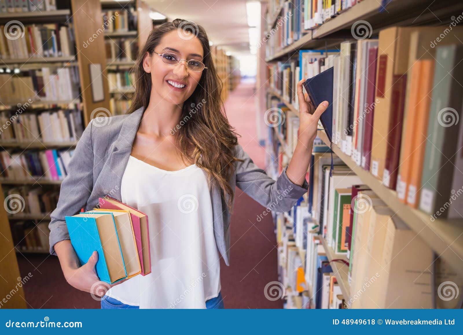 Pretty Student Picking Out a Book in Library Stock Photo - Image of ...