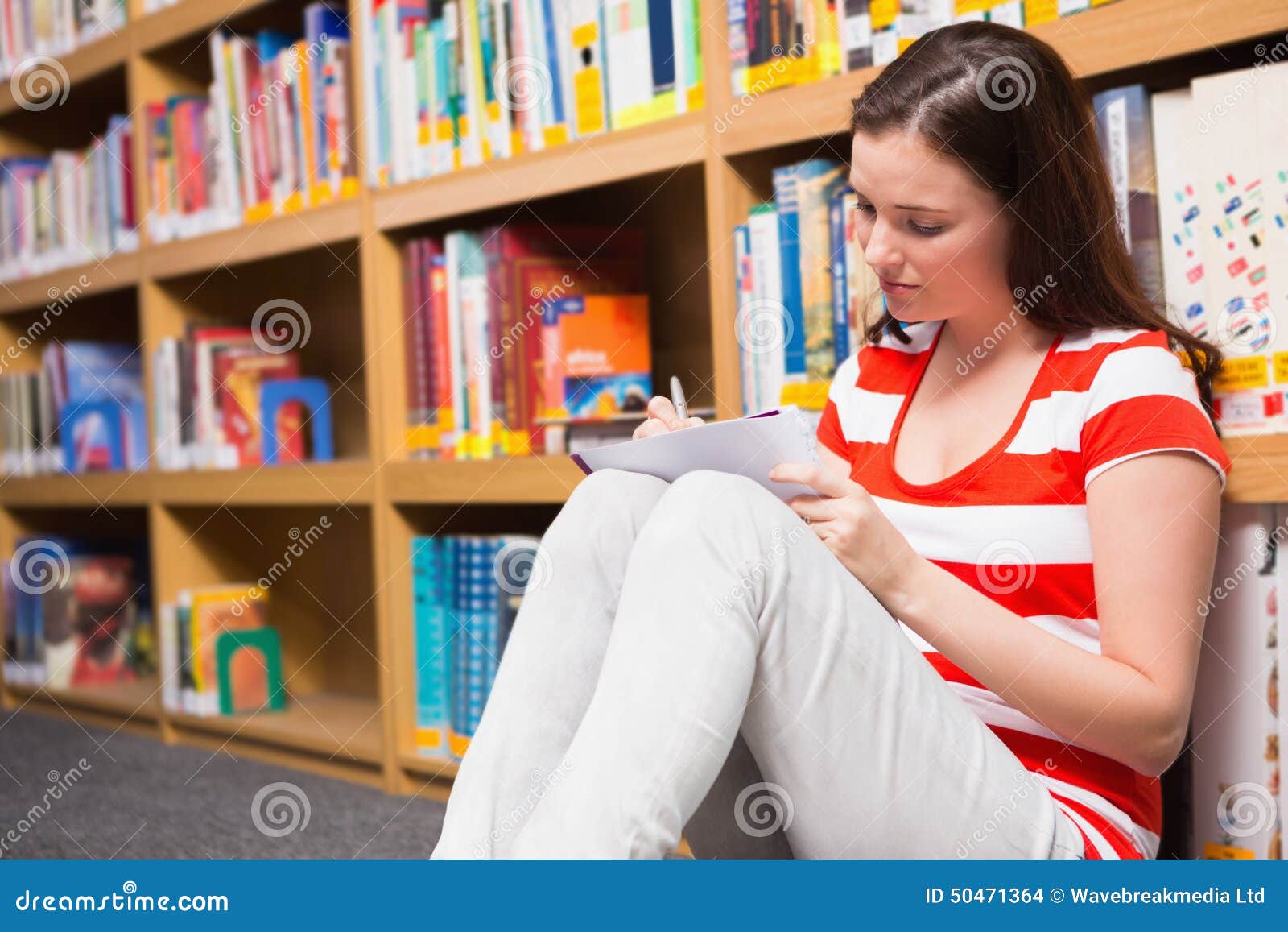 Pretty Student Sitting on Floor Reading Book in Library Stock Photo ...