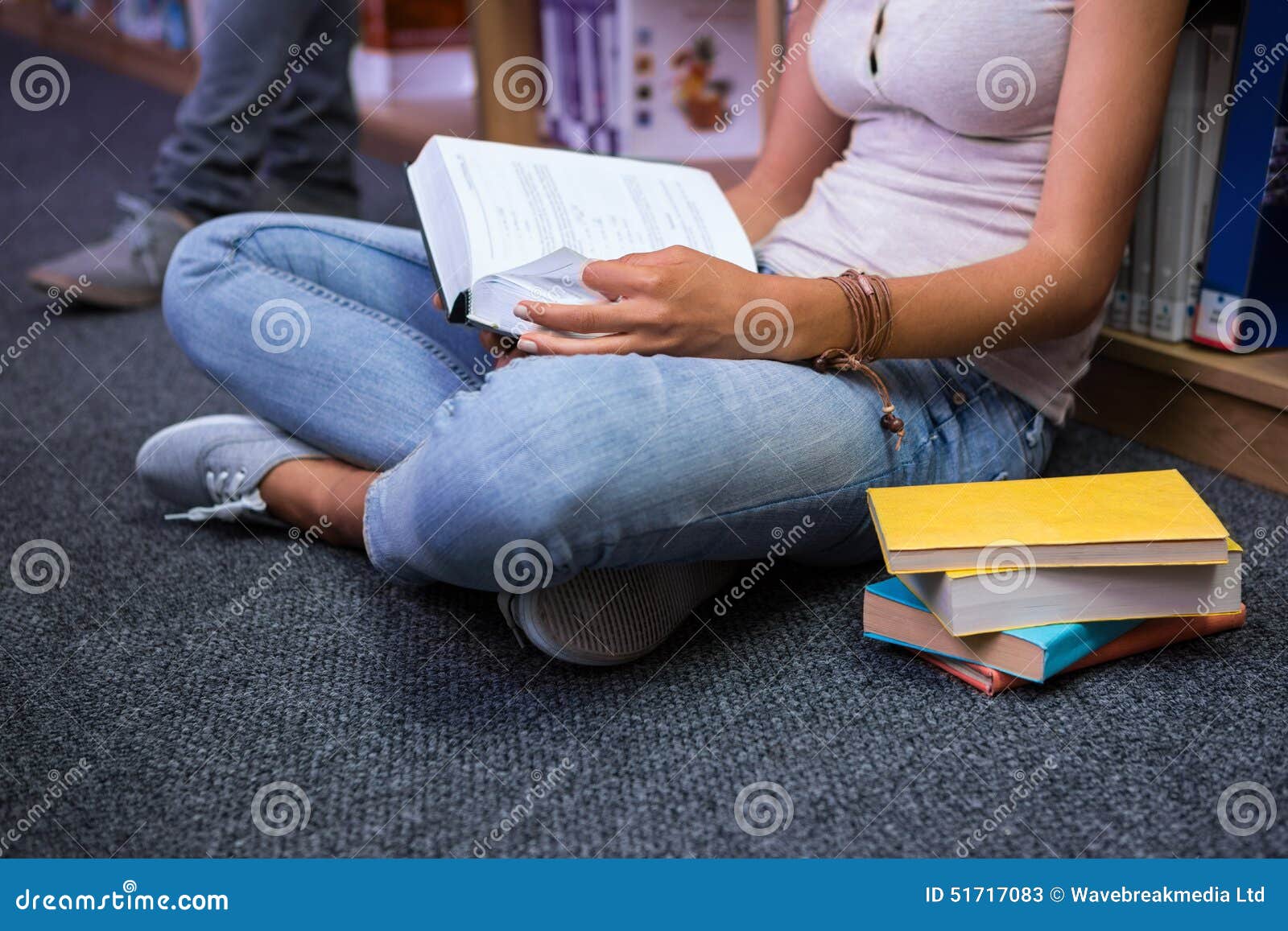 Pretty Student Sitting on Floor Reading Book in Library Stock Image ...