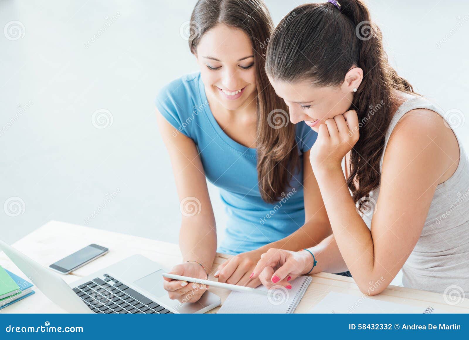 Pretty Students Using a Digital Tablet at Home Stock Photo - Image of ...