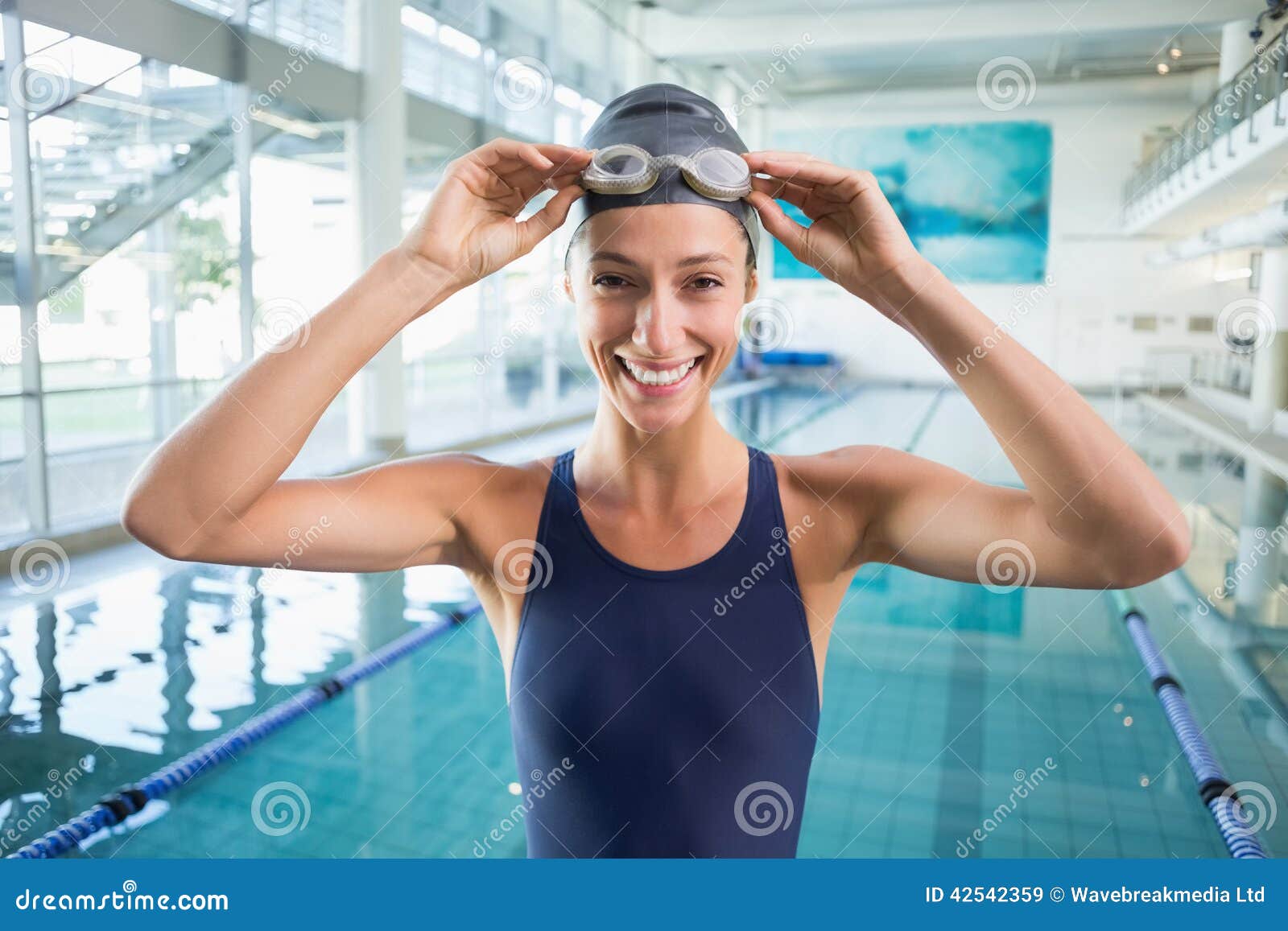 Pretty Swimmer Standing by the Pool Smiling at Camera Stock Image ...
