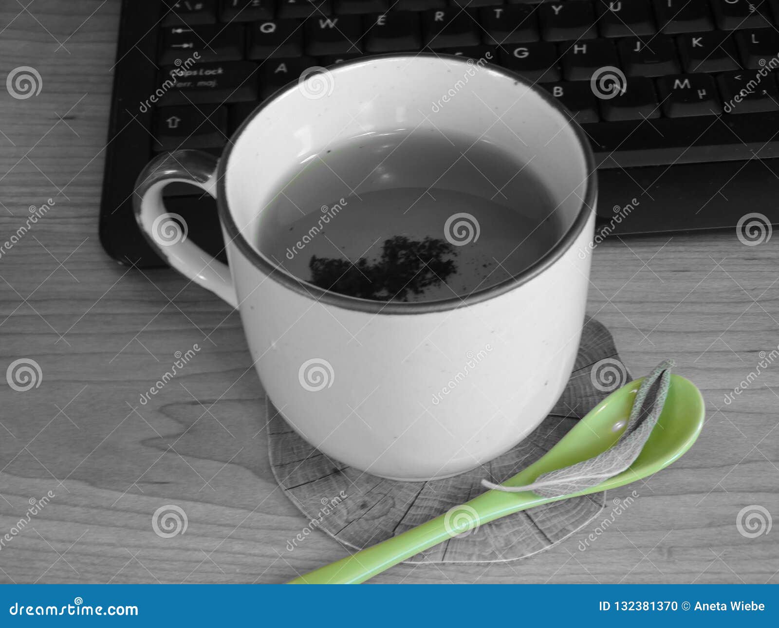 Pretty tea cup by keyboard stock photo. Image of teacup - 132381370
