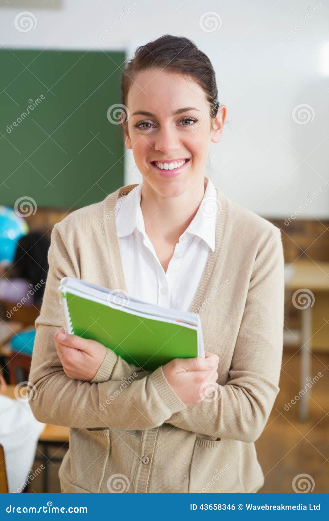 Pretty Teacher Smiling at Camera at Back of Classroom Stock Photo ...