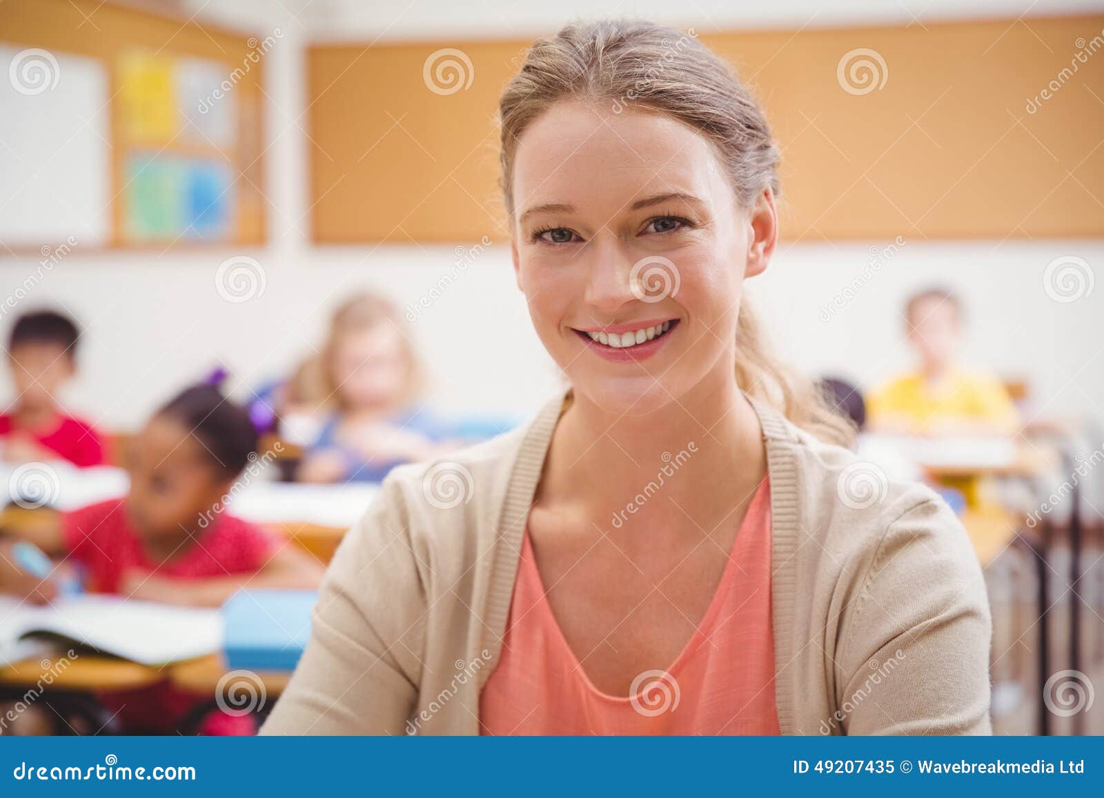 Pretty Teacher Helping Pupil In Classroom Royalty-Free Stock Image ...
