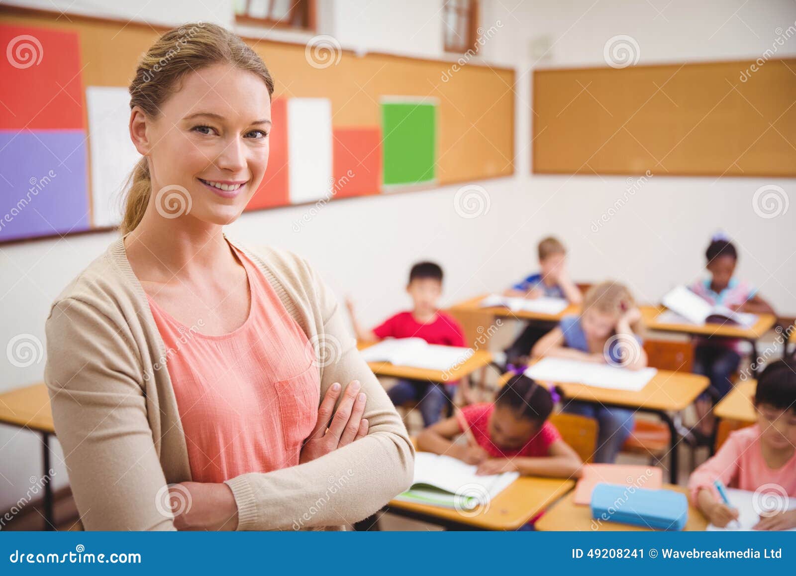 Pretty Teacher Smiling at Camera at Top of Classroom Stock Image ...