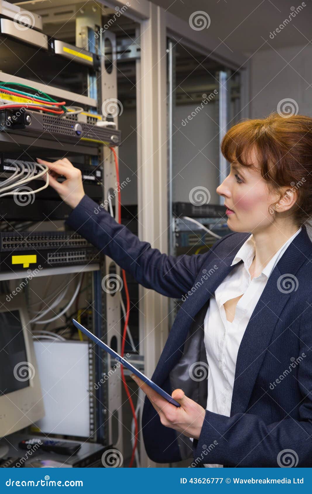 Pretty Technician Using Tablet Pc while Fixing Server Stock Image ...