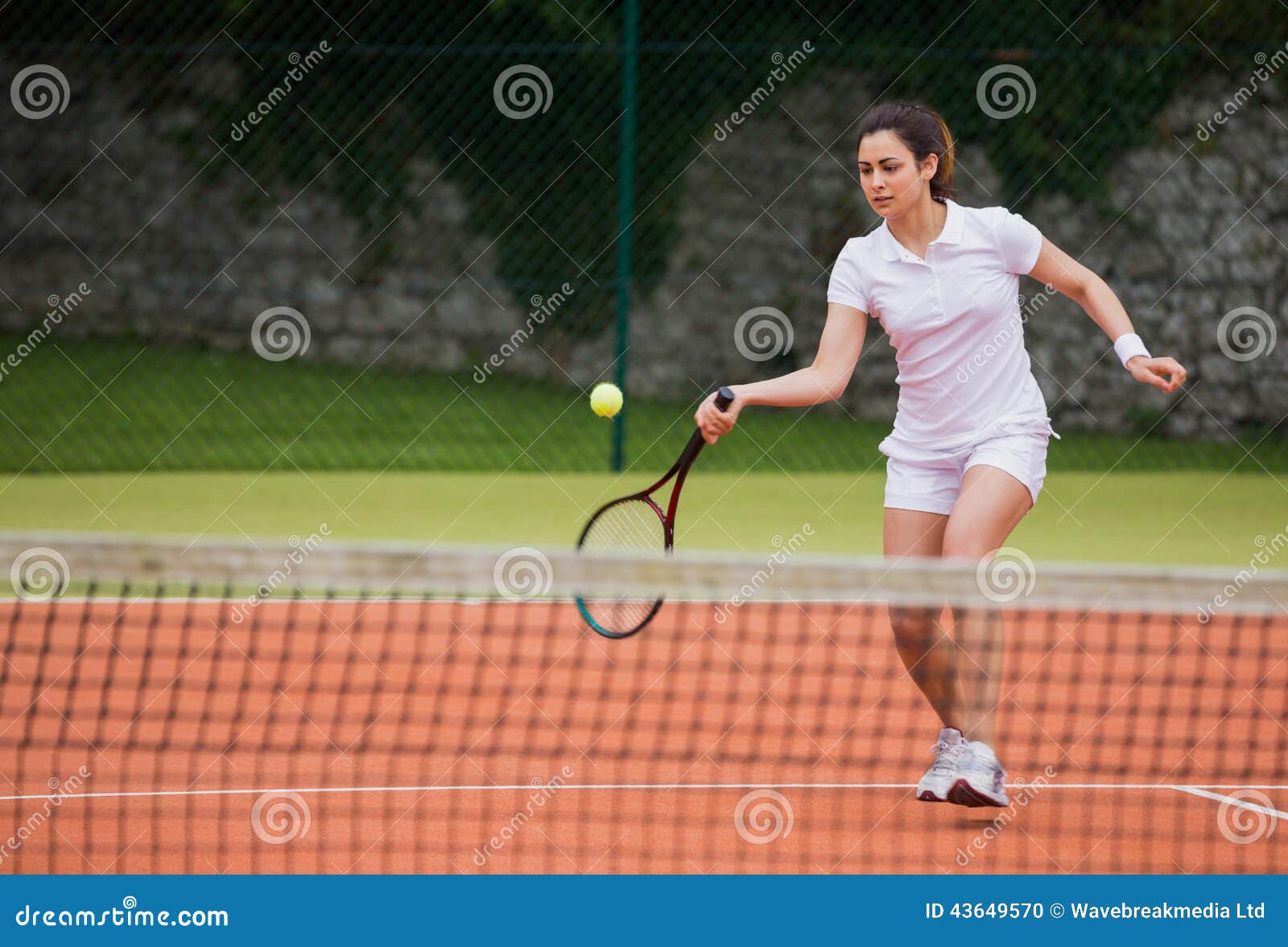 Pretty Tennis Player Hitting Ball Stock Photo - Image of active, female ...