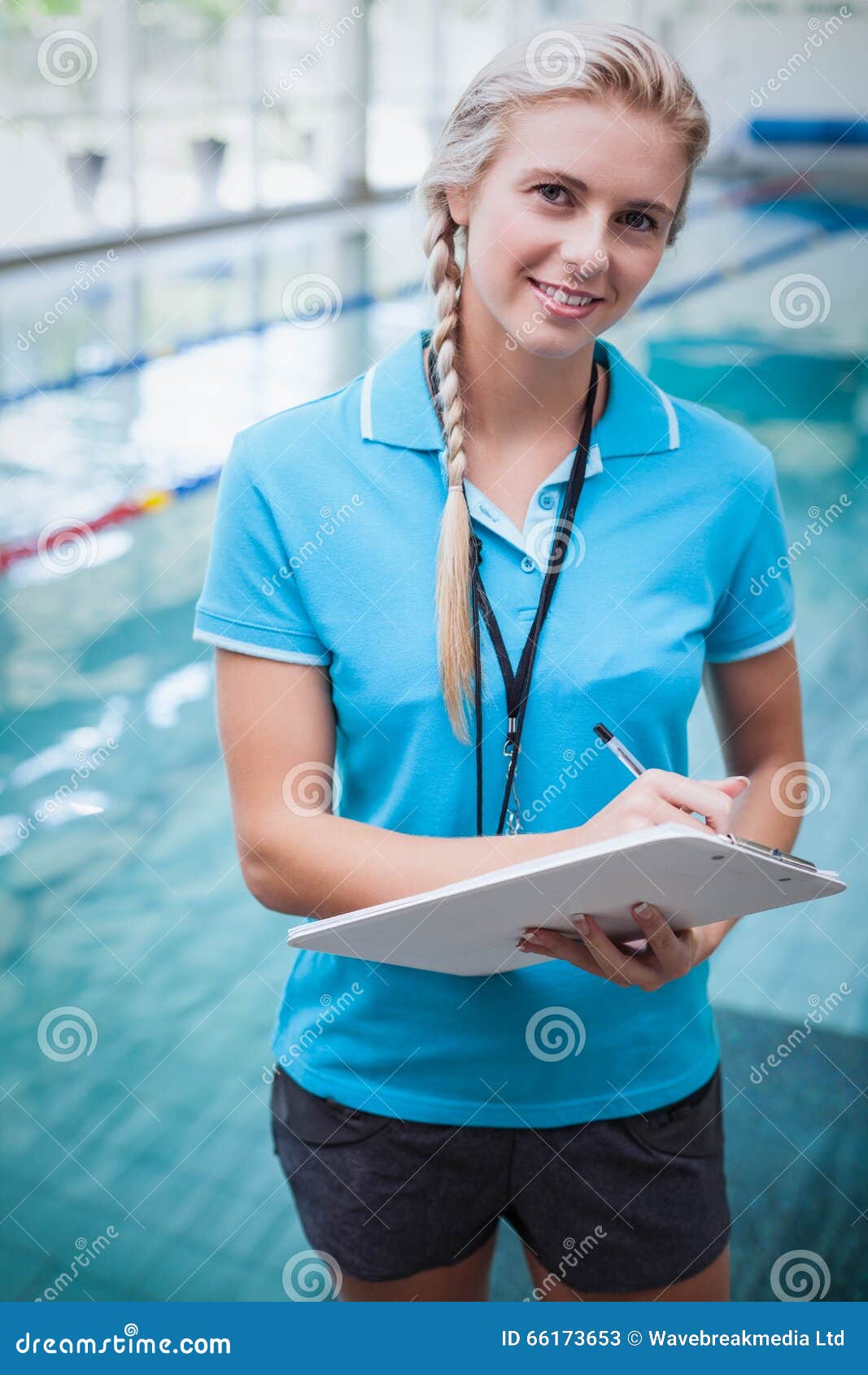 Pretty Trainer Writing on Clipboard Stock Image - Image of activity ...