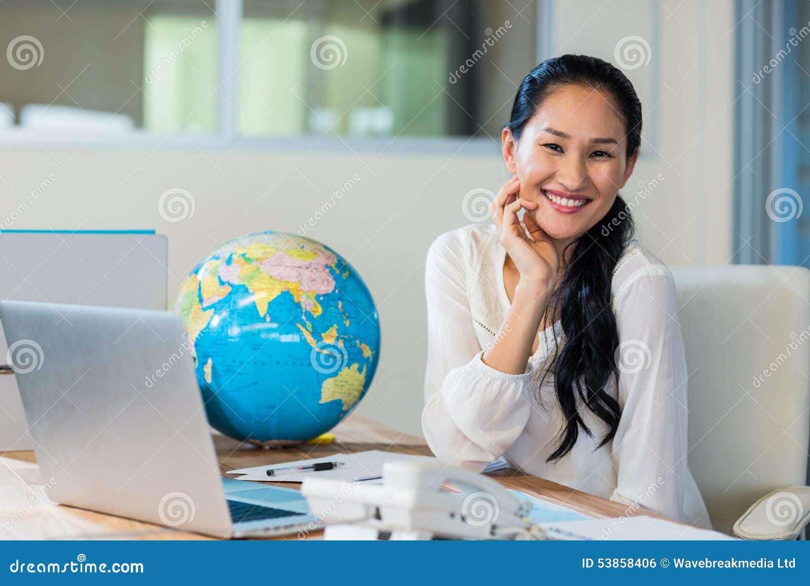 Pretty Travel Agent Smiling at Camera Stock Photo - Image of world ...