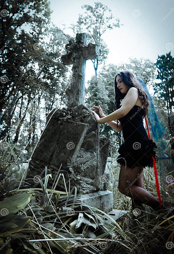 Pretty vampire near tree stock photo. Image of creature - 45240630