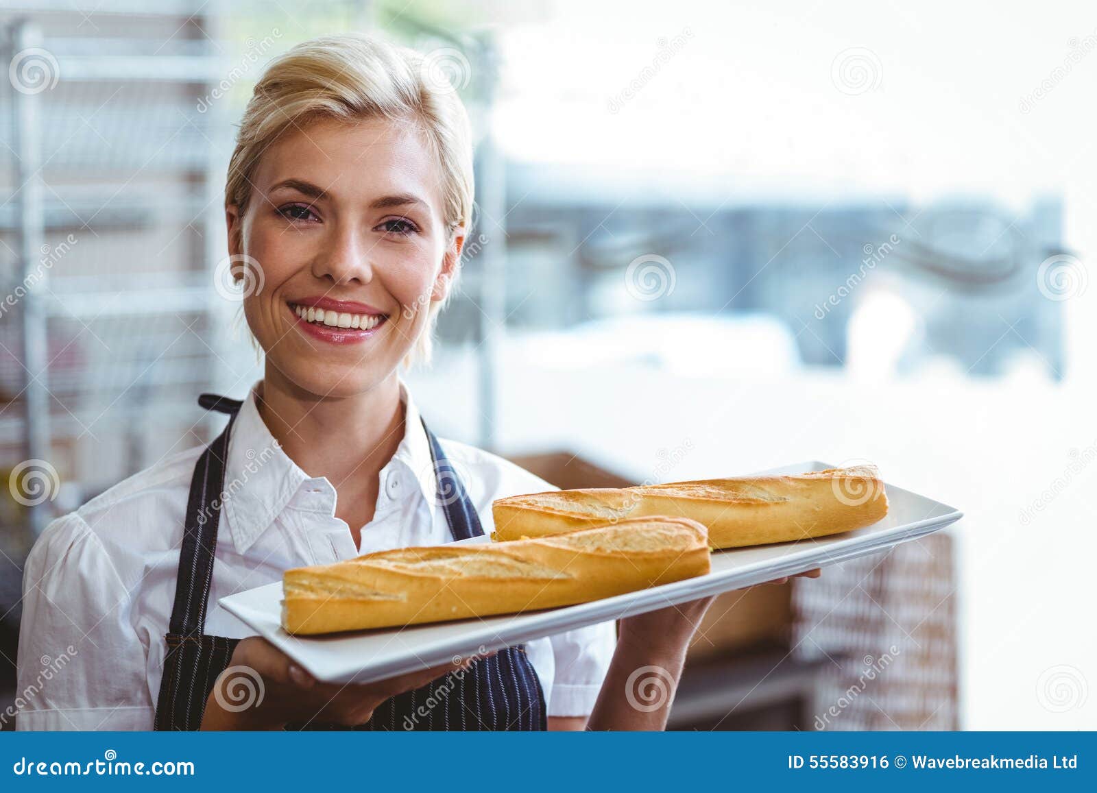 Pretty Waitress Carrying Baguettes Stock Photo - Image of basket ...
