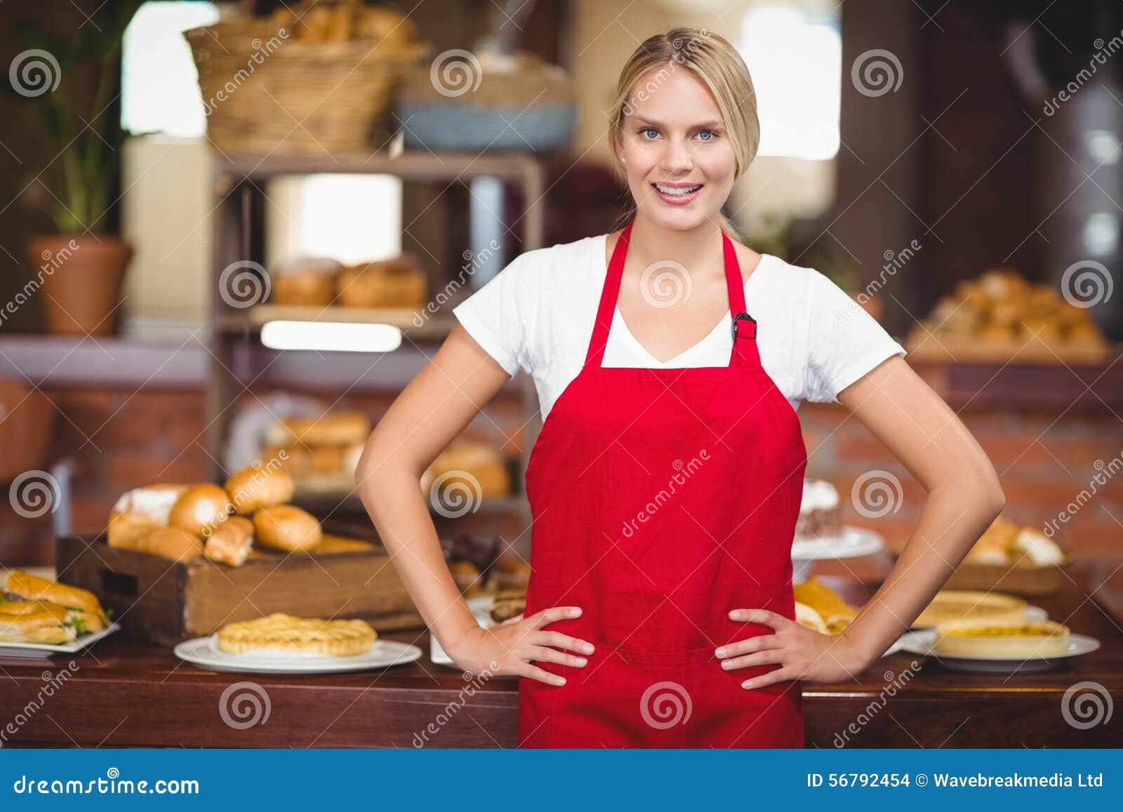 Pretty Waitress with Hands on Hips Stock Photo - Image of food ...