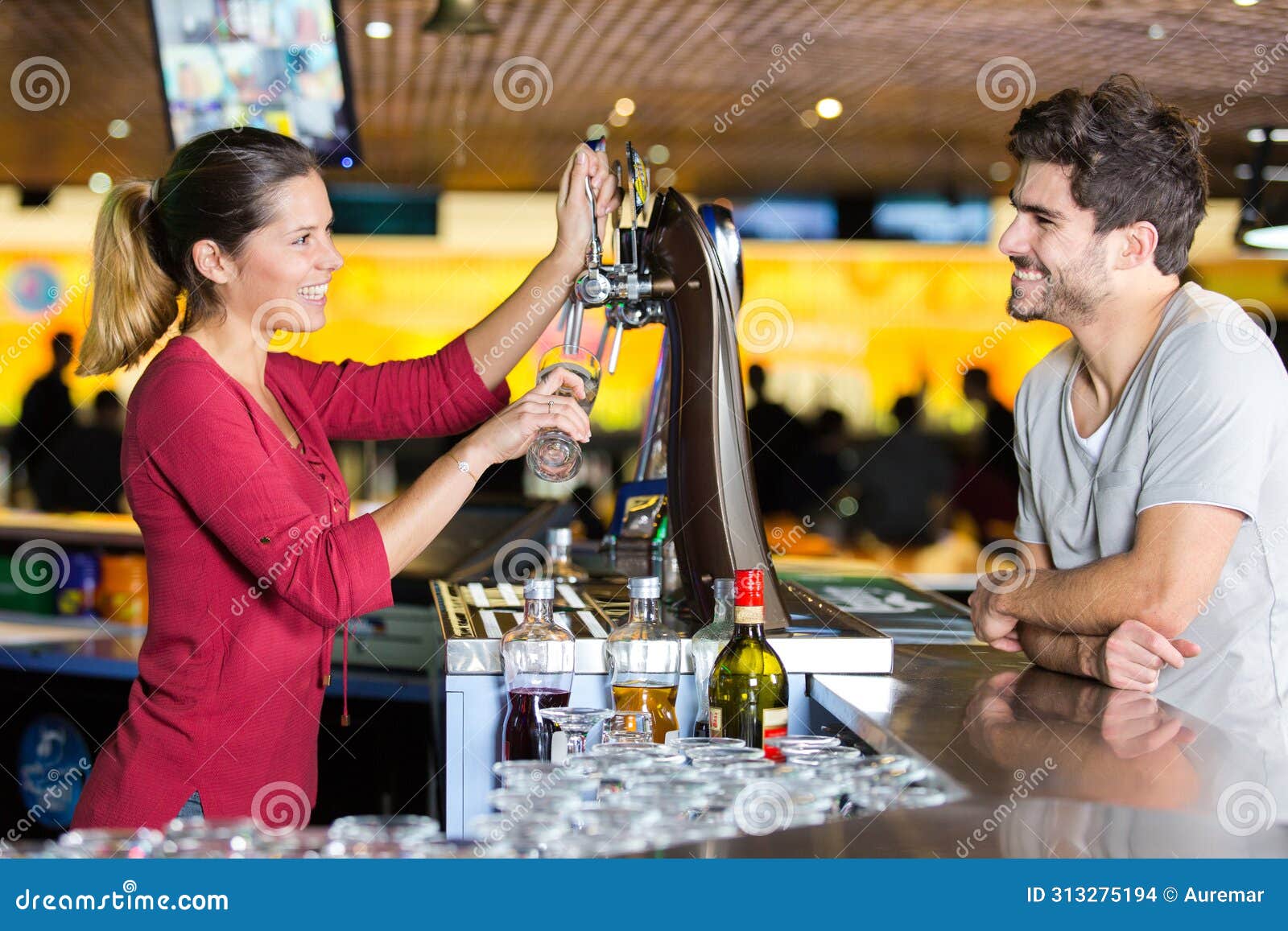 Pretty Waitress Standing at Counter Talking To Customer Stock Photo ...