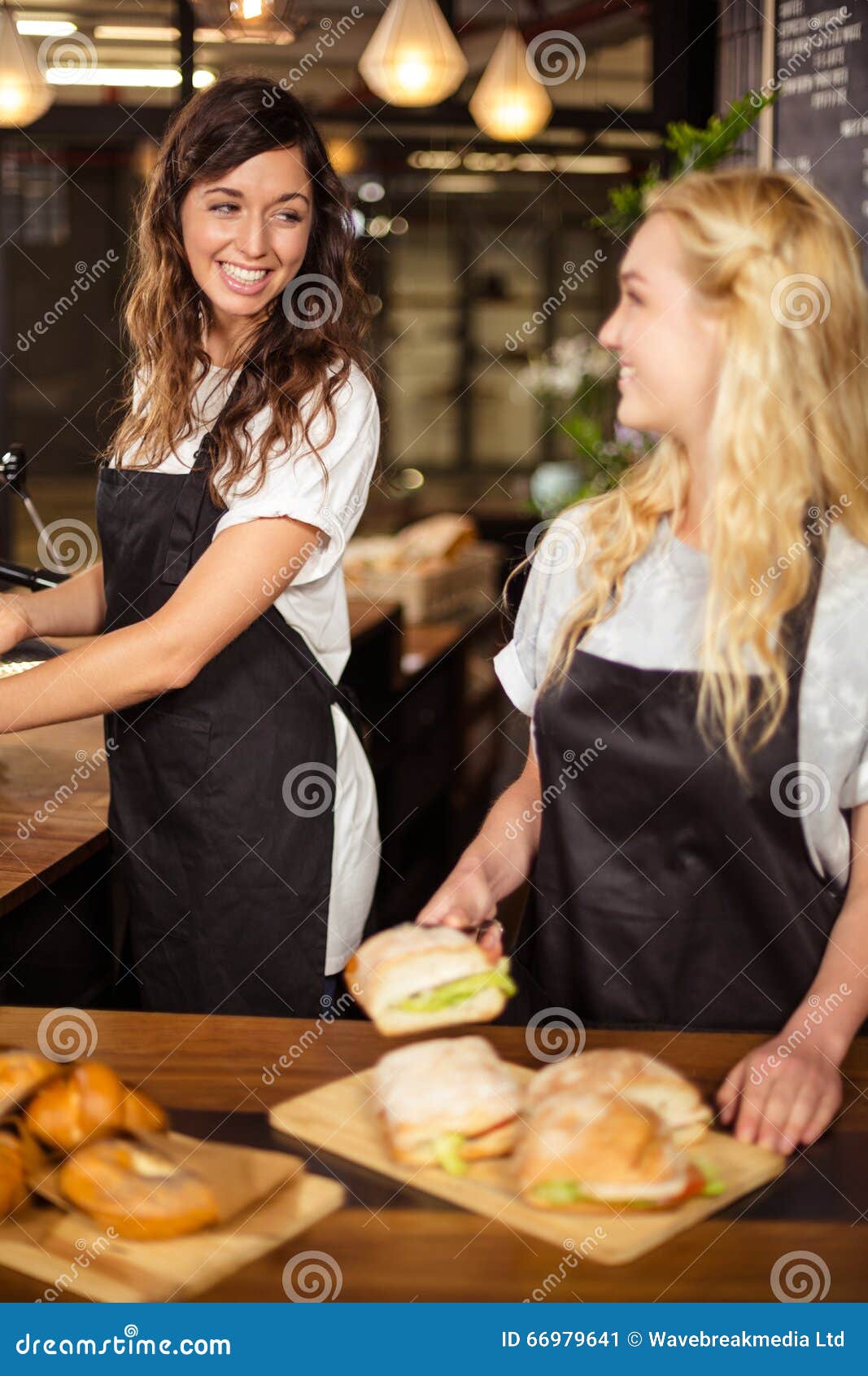 Pretty Waitresses Behind the Counter Working Stock Image - Image of ...