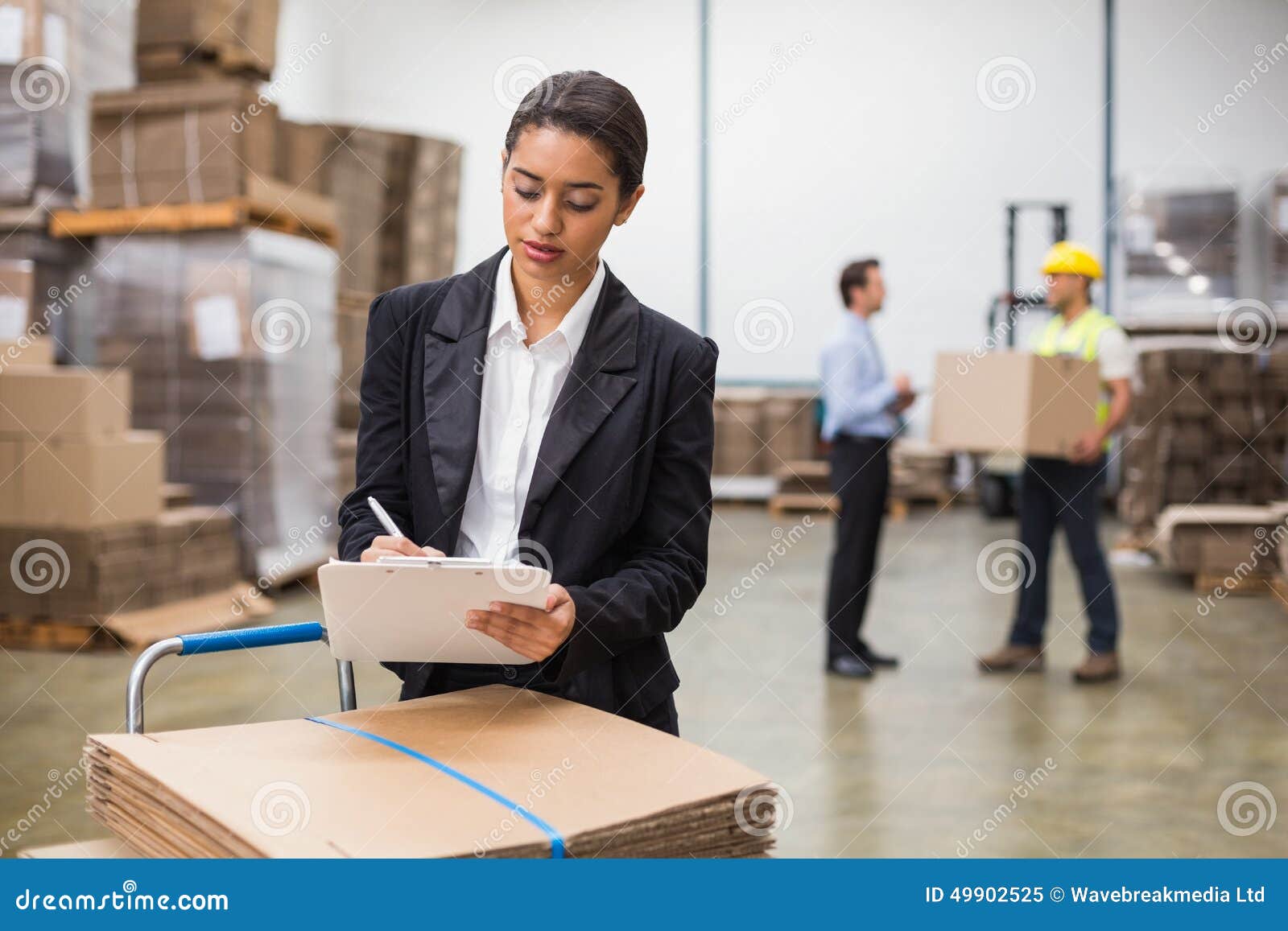 Pretty Warehouse Manager Writing on Clipboard Stock Image - Image of ...