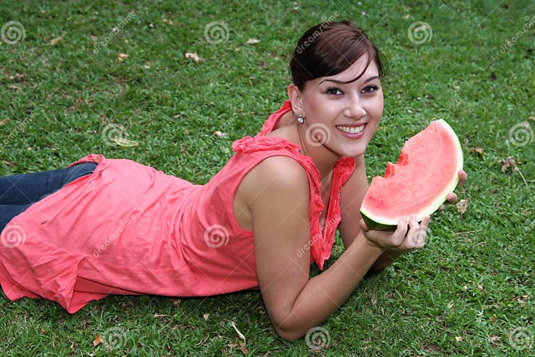 Pretty Watermelon Eater stock photo. Image of jeans, green - 13378078