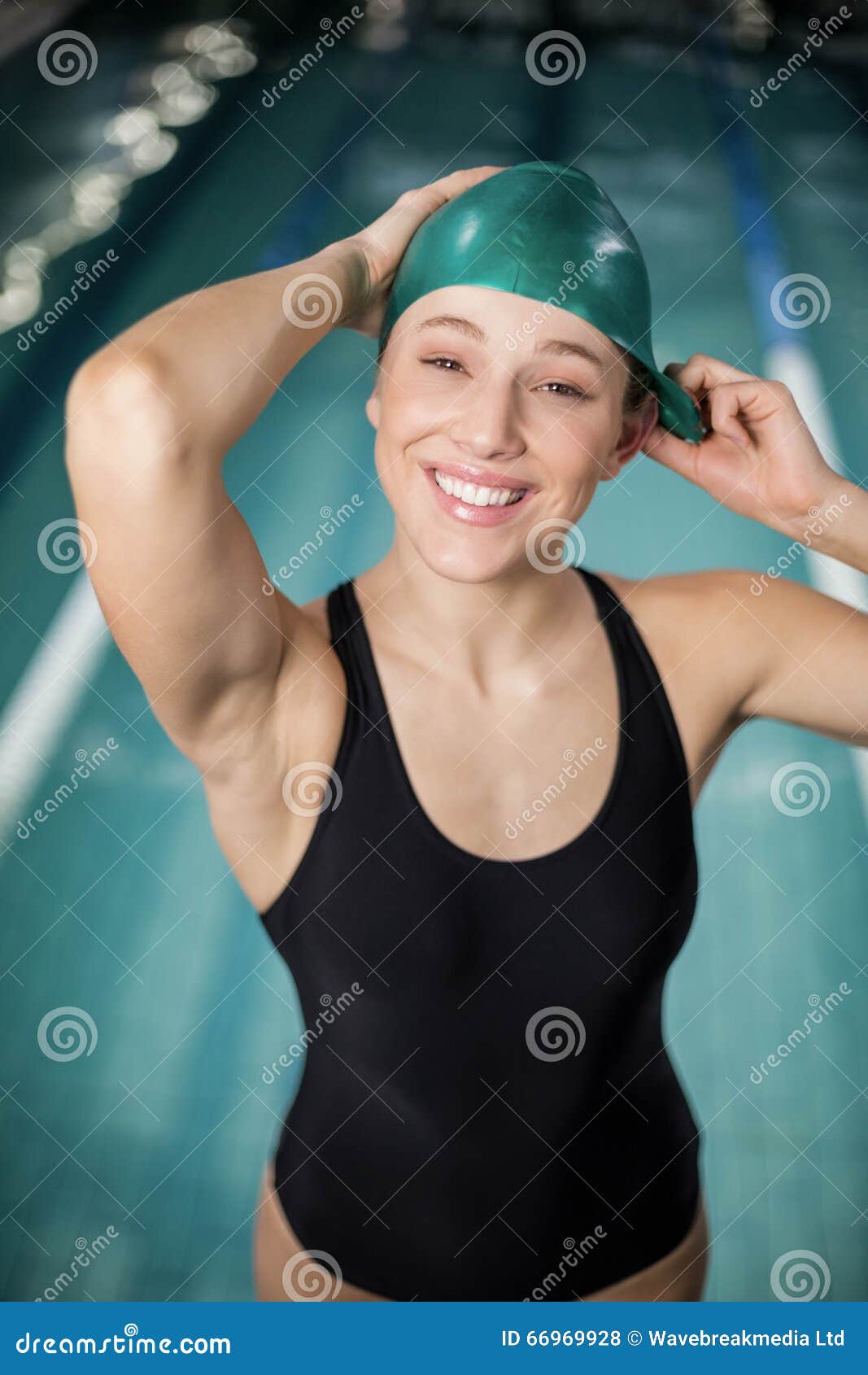 Pretty Woman Adjusting Her Bathing Cap Stock Photo - Image of smiling ...