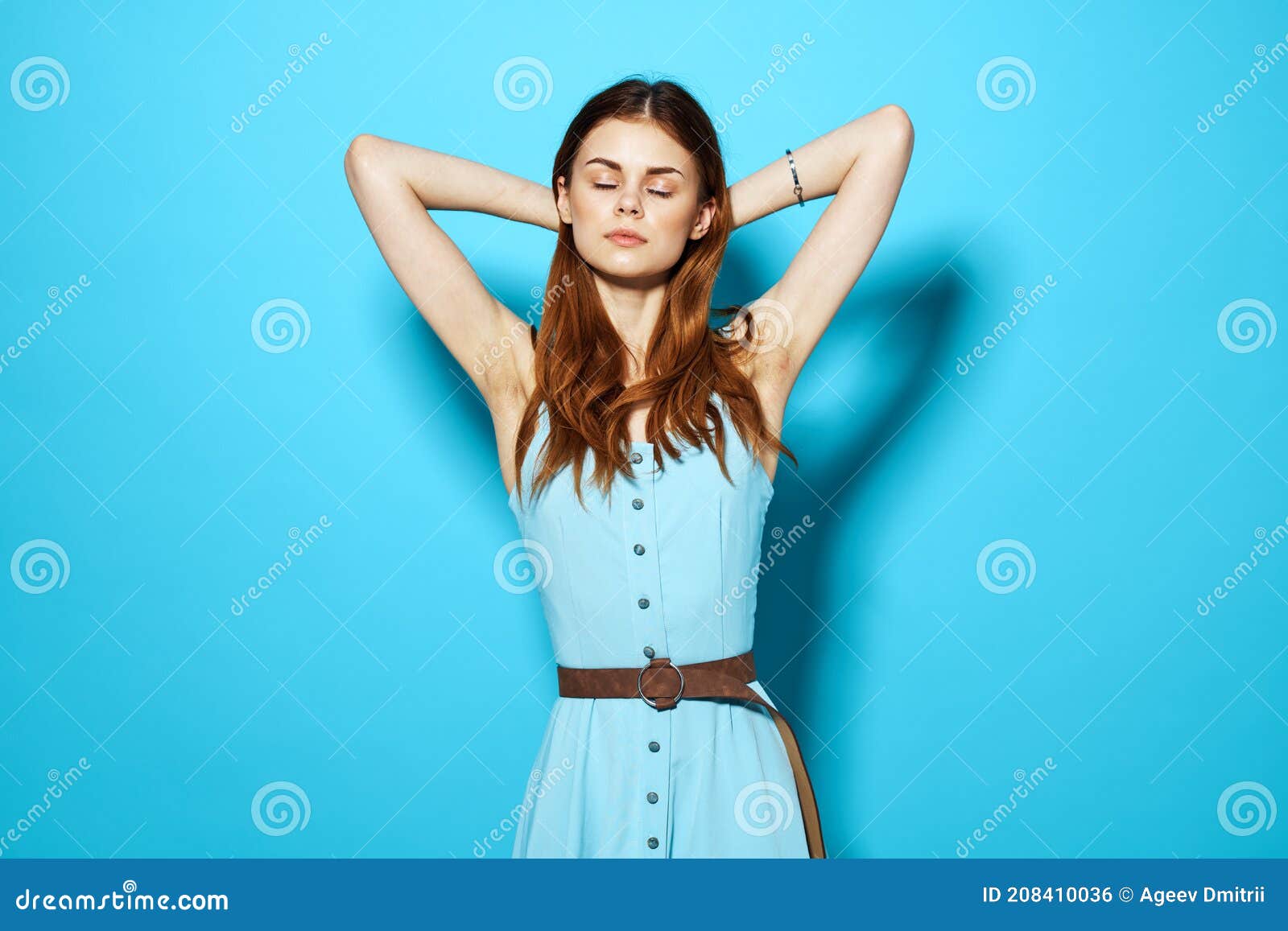 Pretty Woman In Blue Dress Holding Her Hair Glamor Attractive Look Blue