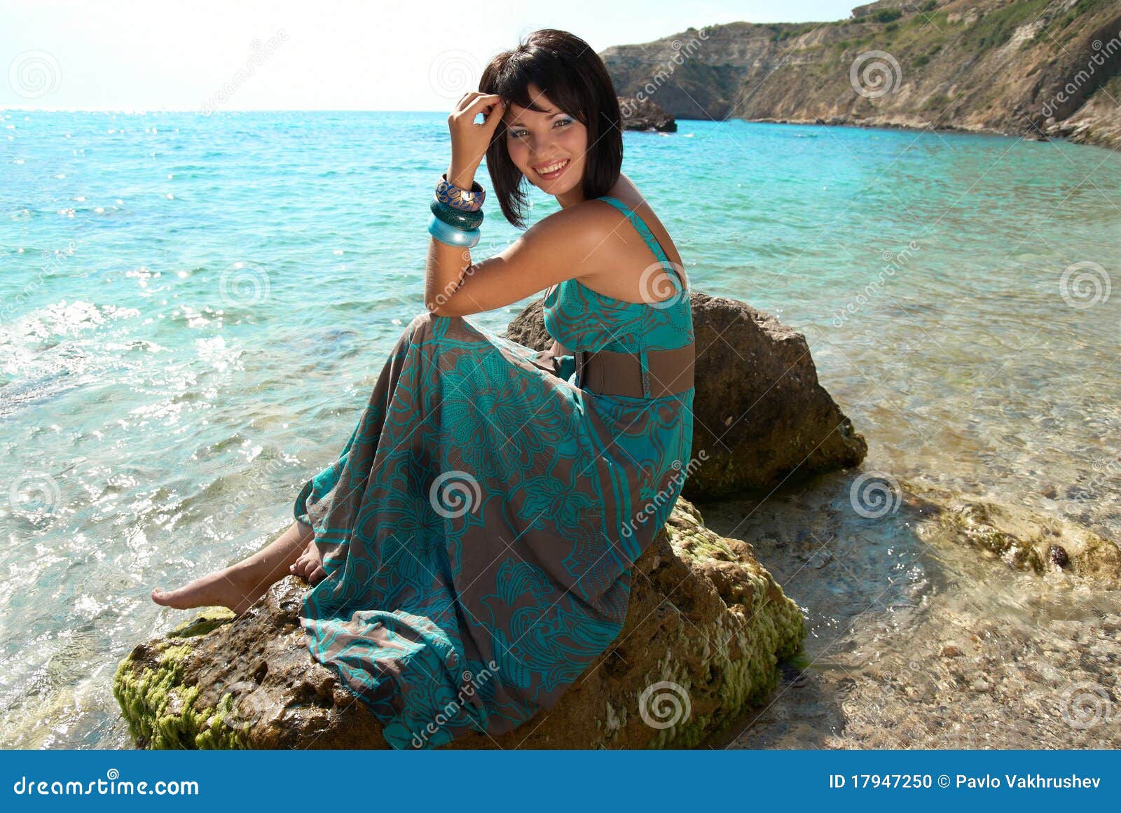 Pretty woman on the coast stock photo. Image of holiday - 17947250