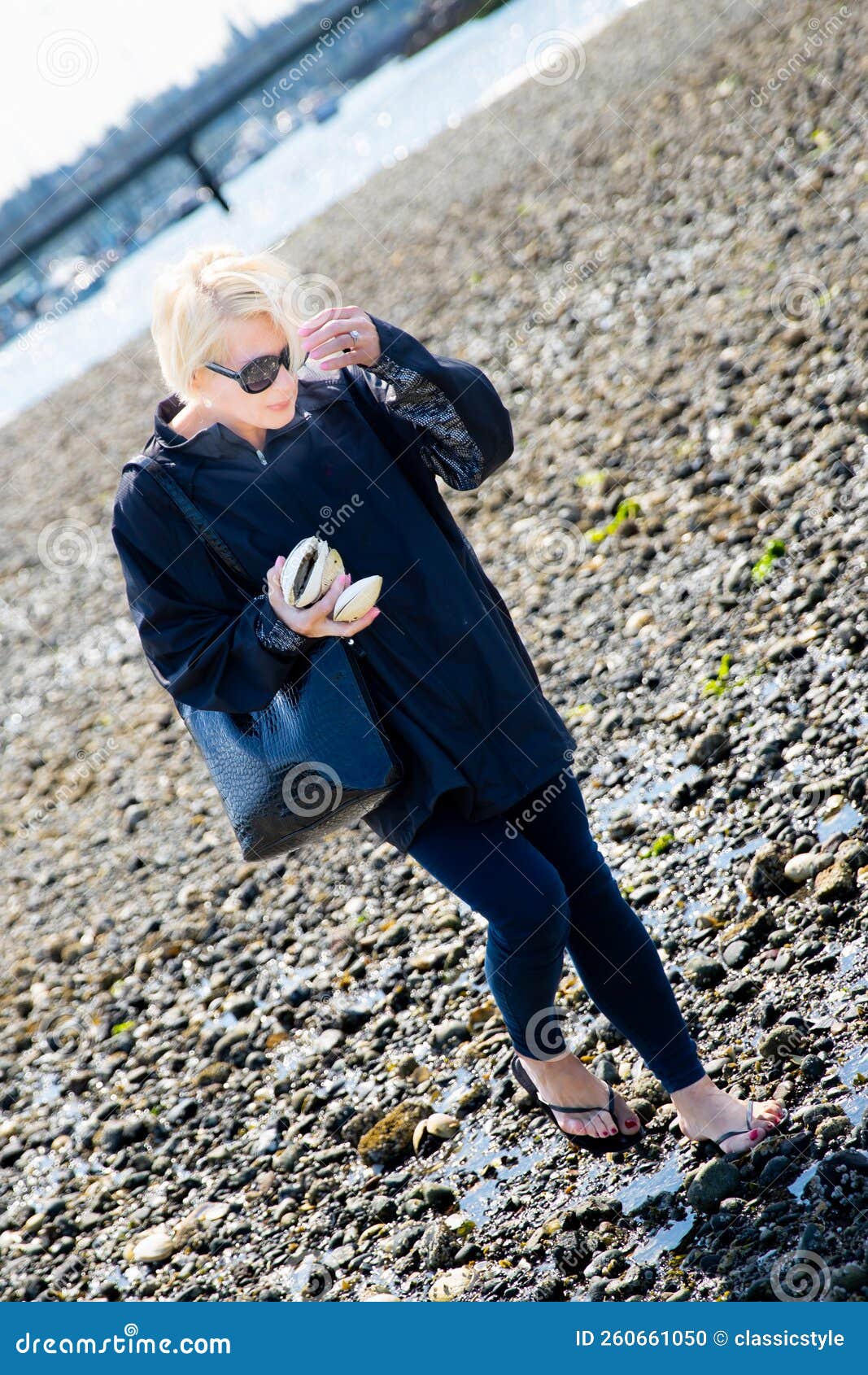 Pretty Woman Collecting Shells Stock Photo - Image of outdoors ...