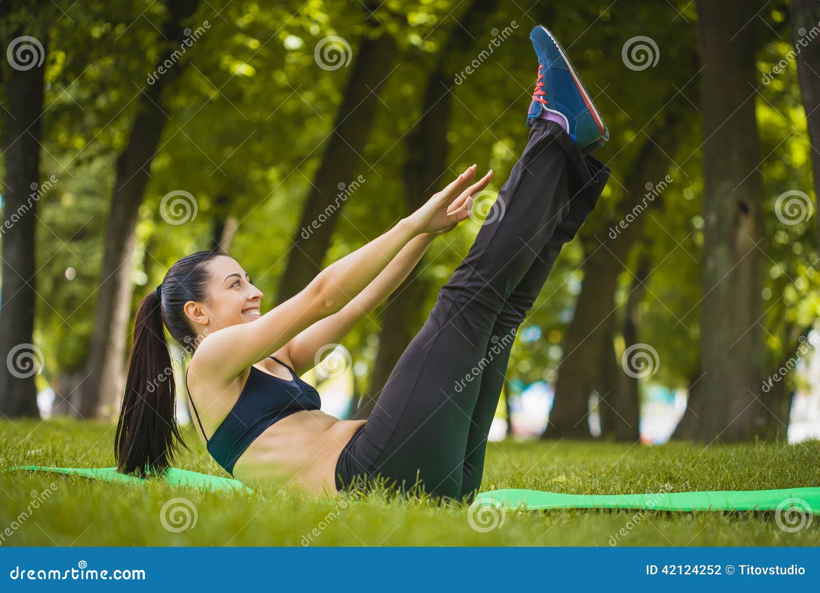 Pretty Woman Doing Exercises in the Park Stock Photo - Image of balance ...