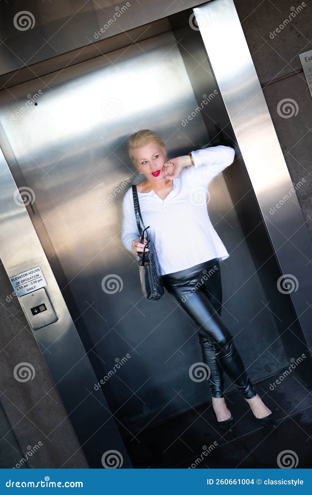 Pretty woman elevator stock photo. Image of face, clothing - 260661004