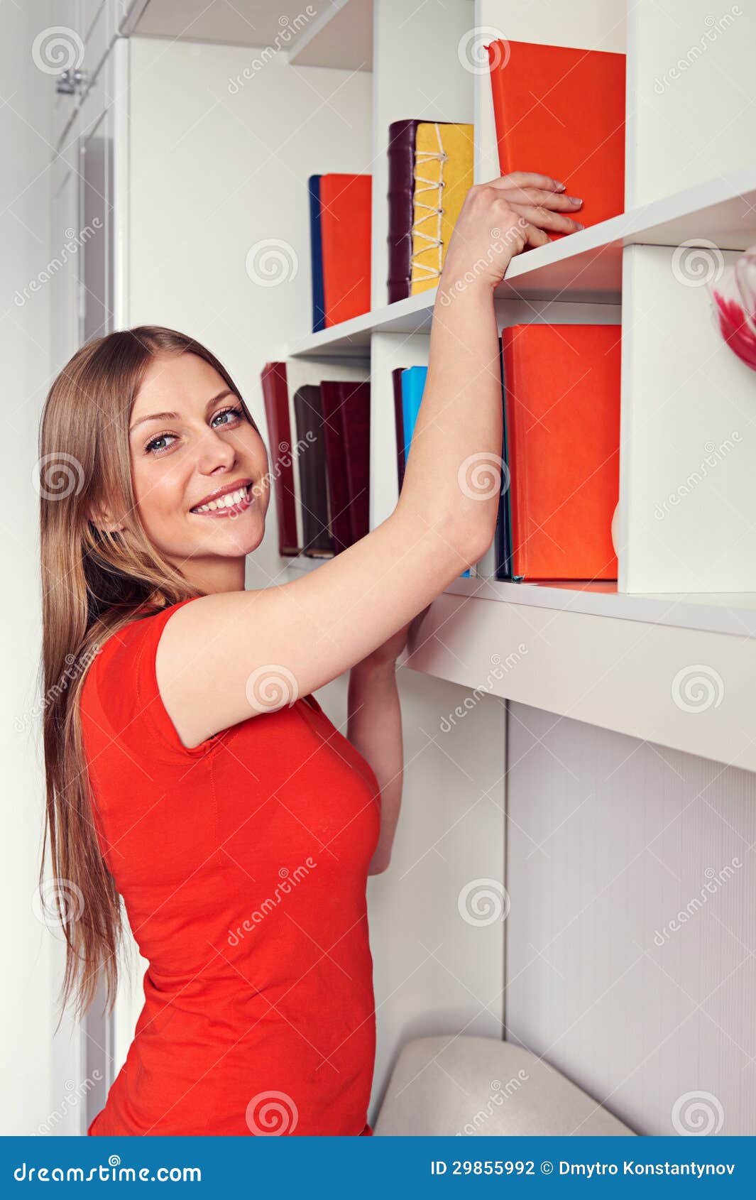 Woman Getting Book and Smiling Stock Photo - Image of modern, girl ...