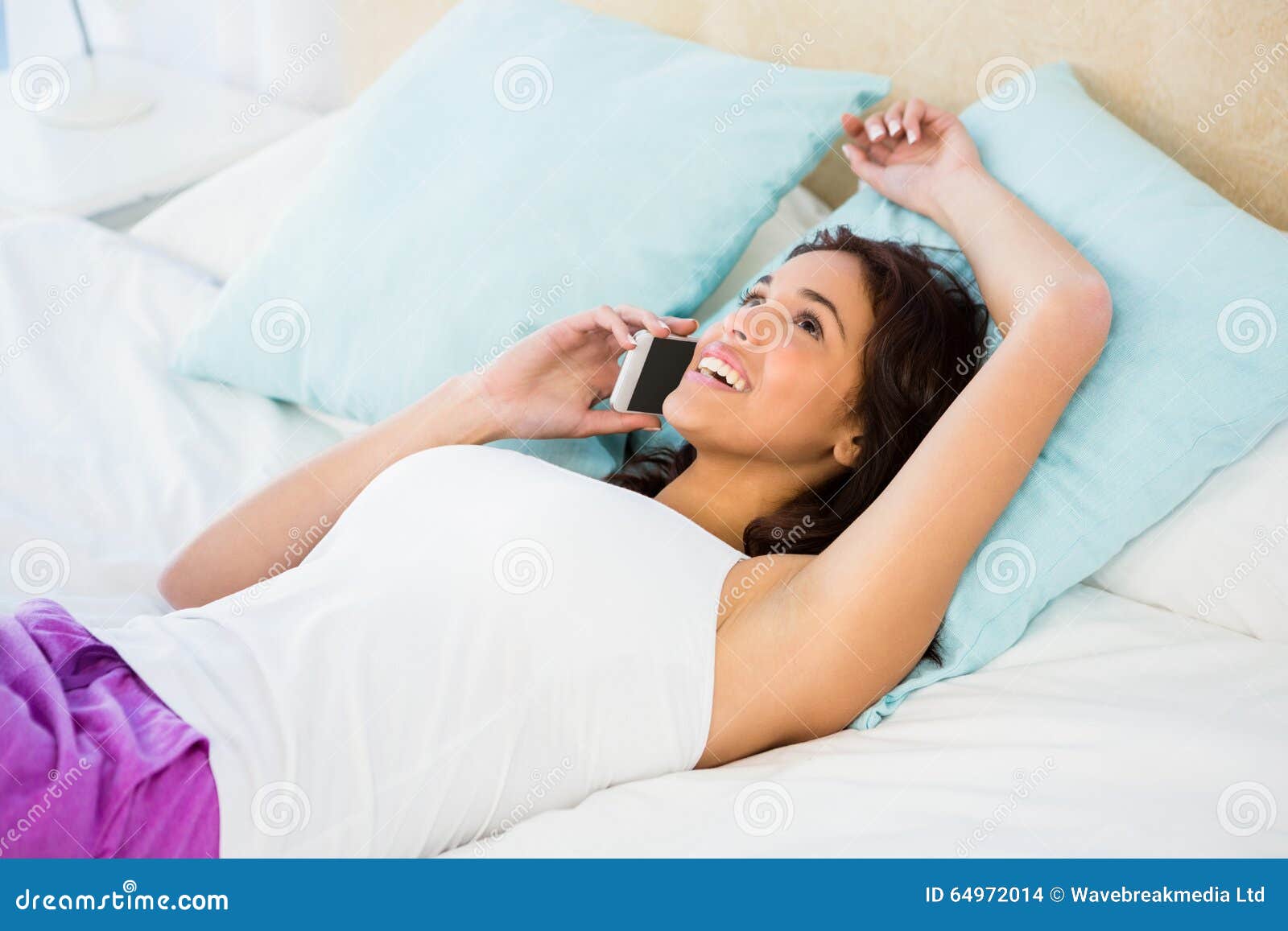 Pretty Woman Having a Phone Call while Lying on the Bed Stock Photo ...