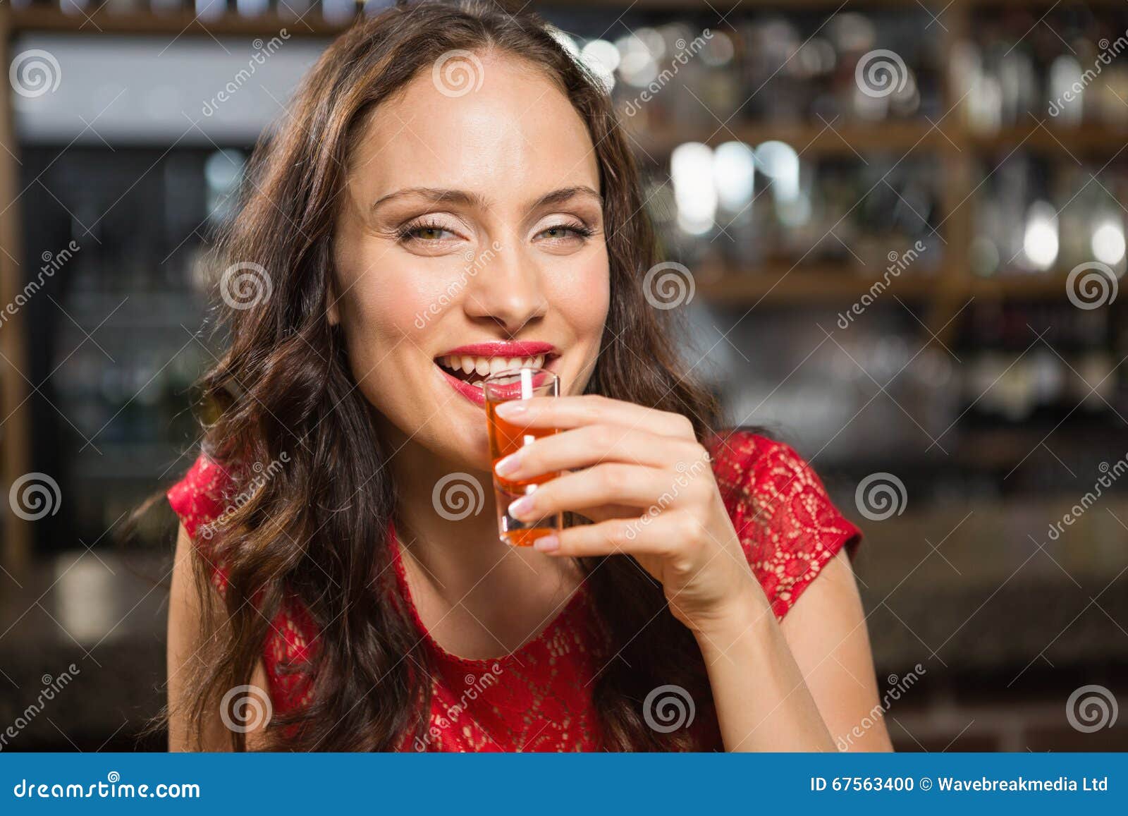 Pretty woman having a shot stock photo. Image of pleasure - 67563400