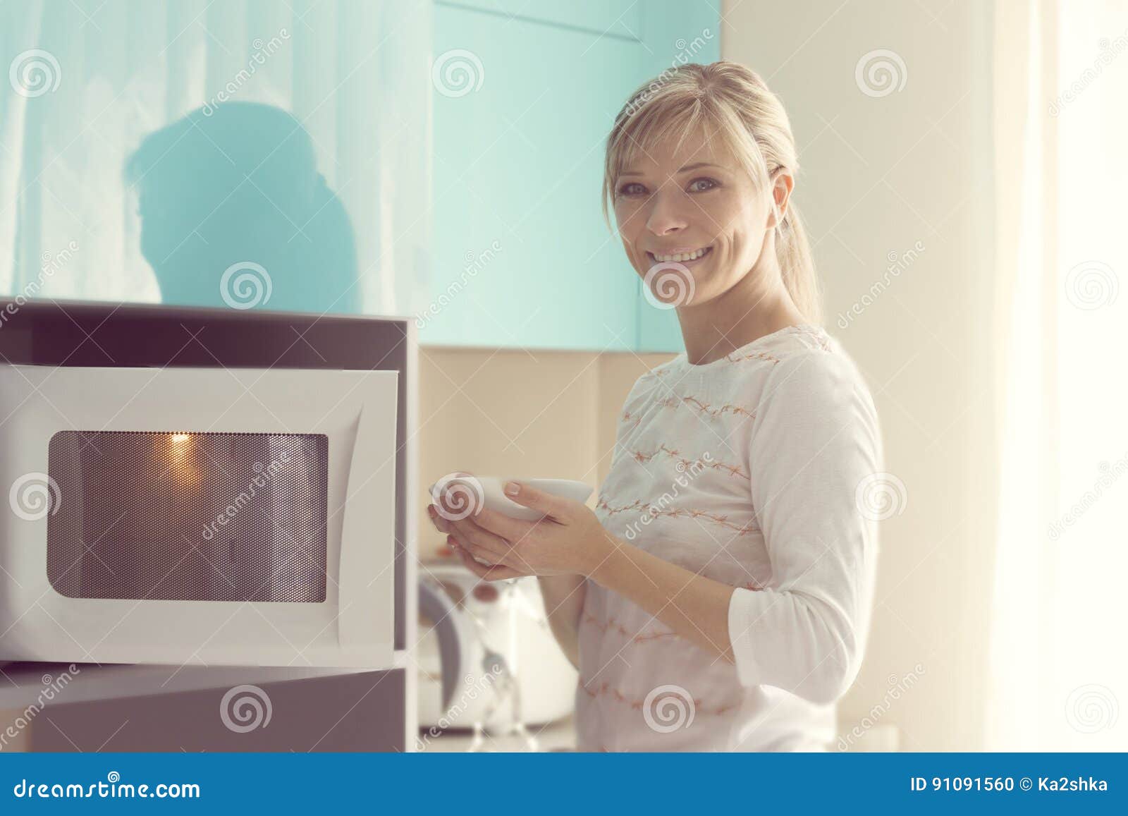 Pretty Woman at Home Using Microwave Oven Stock Photo - Image of ...