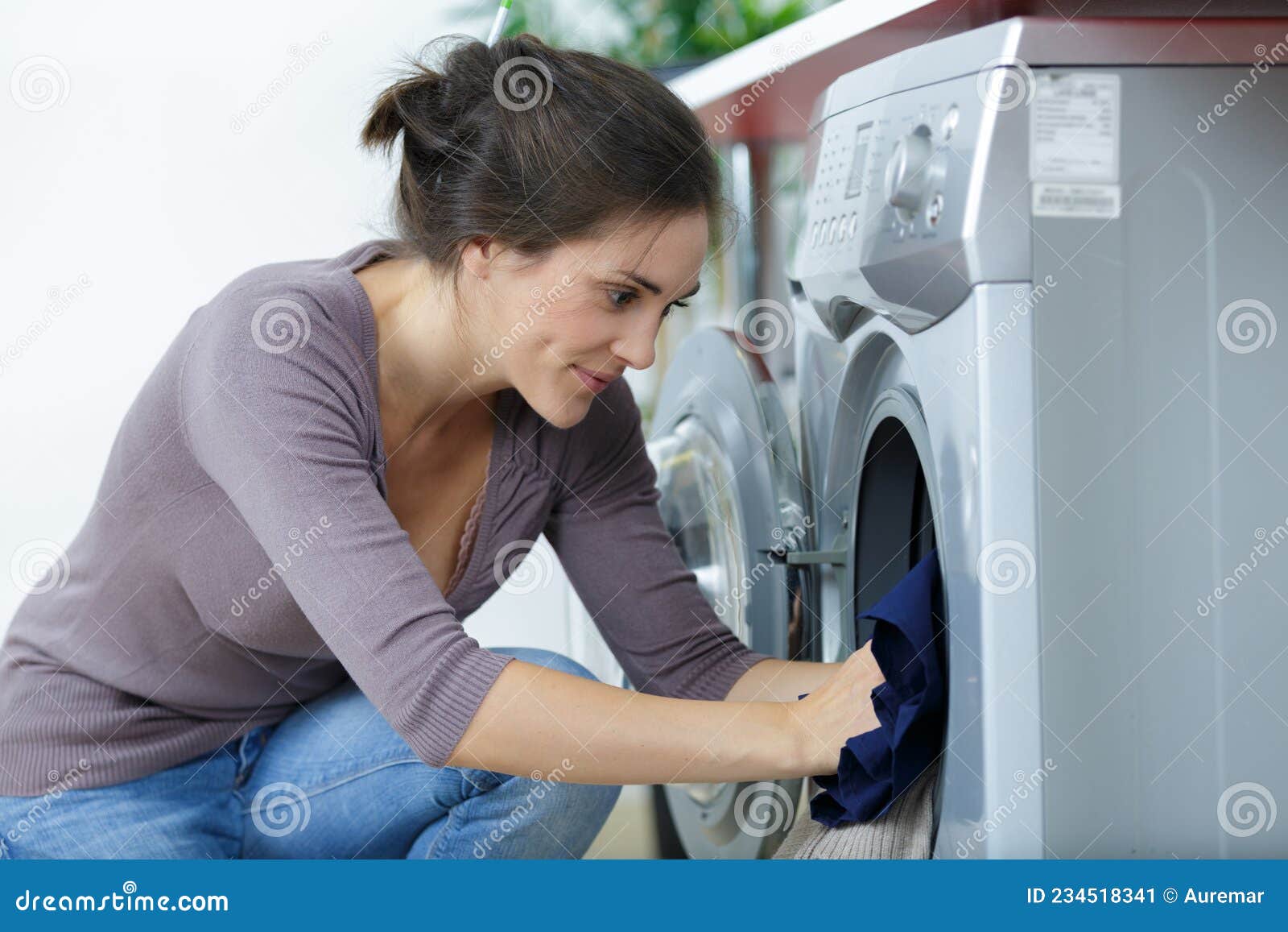 Pretty Woman Loading Washing Machine Stock Image - Image of side ...
