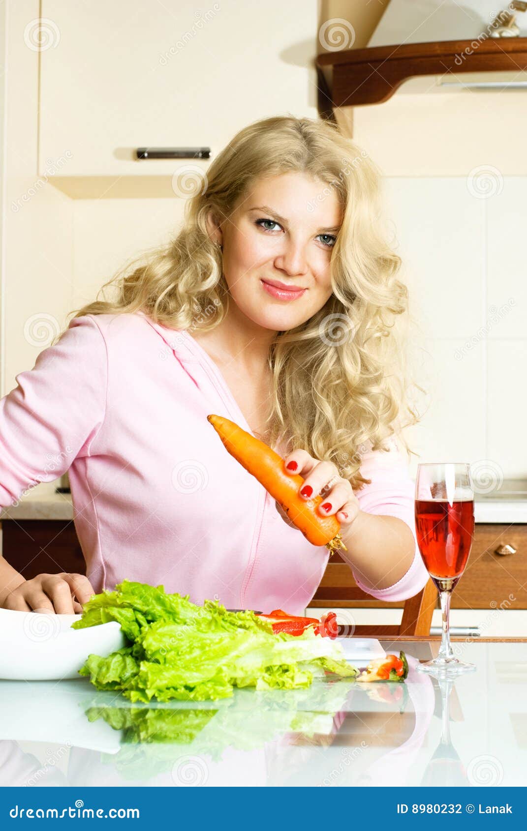 Pretty woman making salad stock photo. Image of cheerful - 8980232