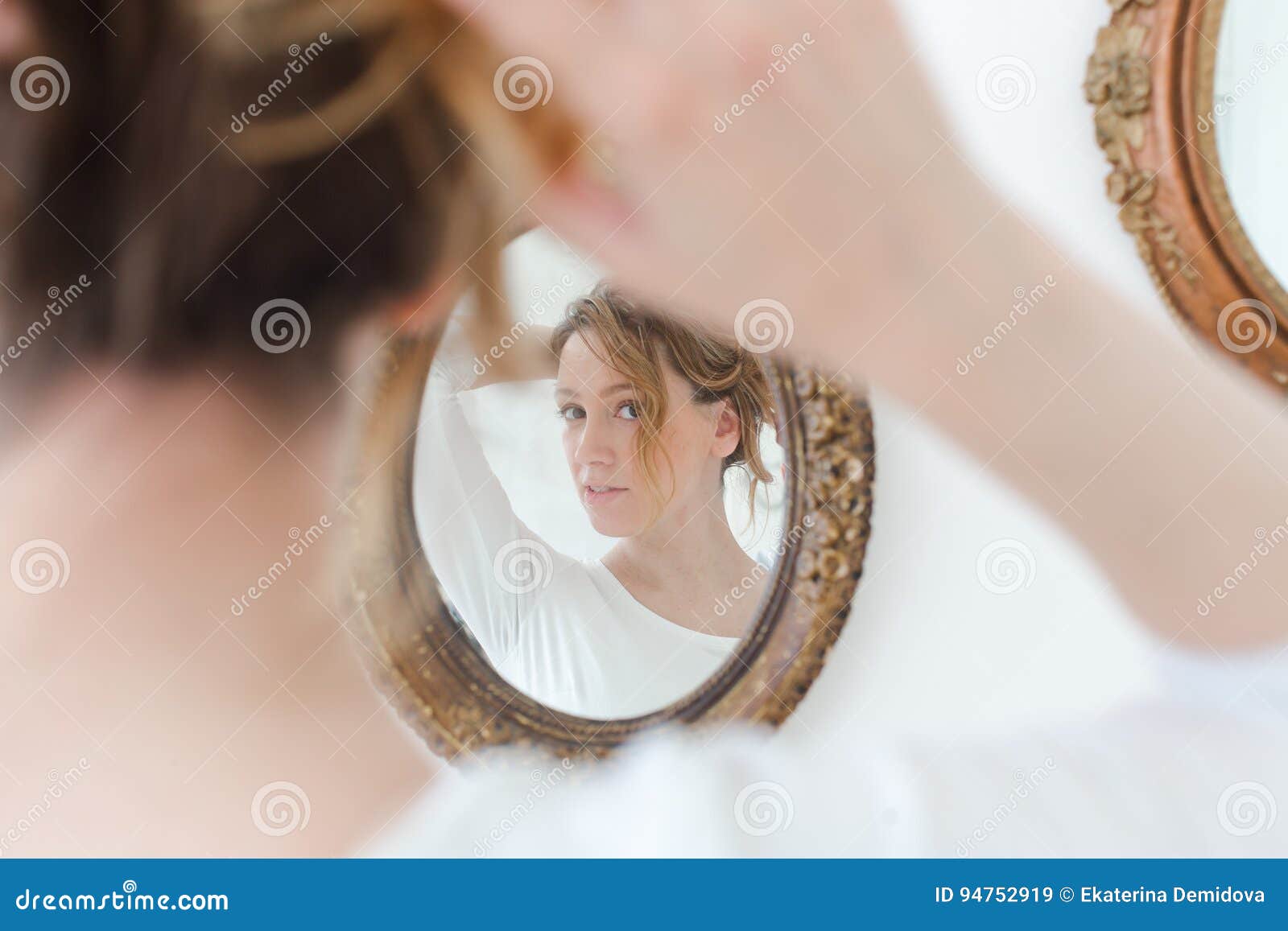 Pretty woman at mirror stock image. Image of interior - 94752919