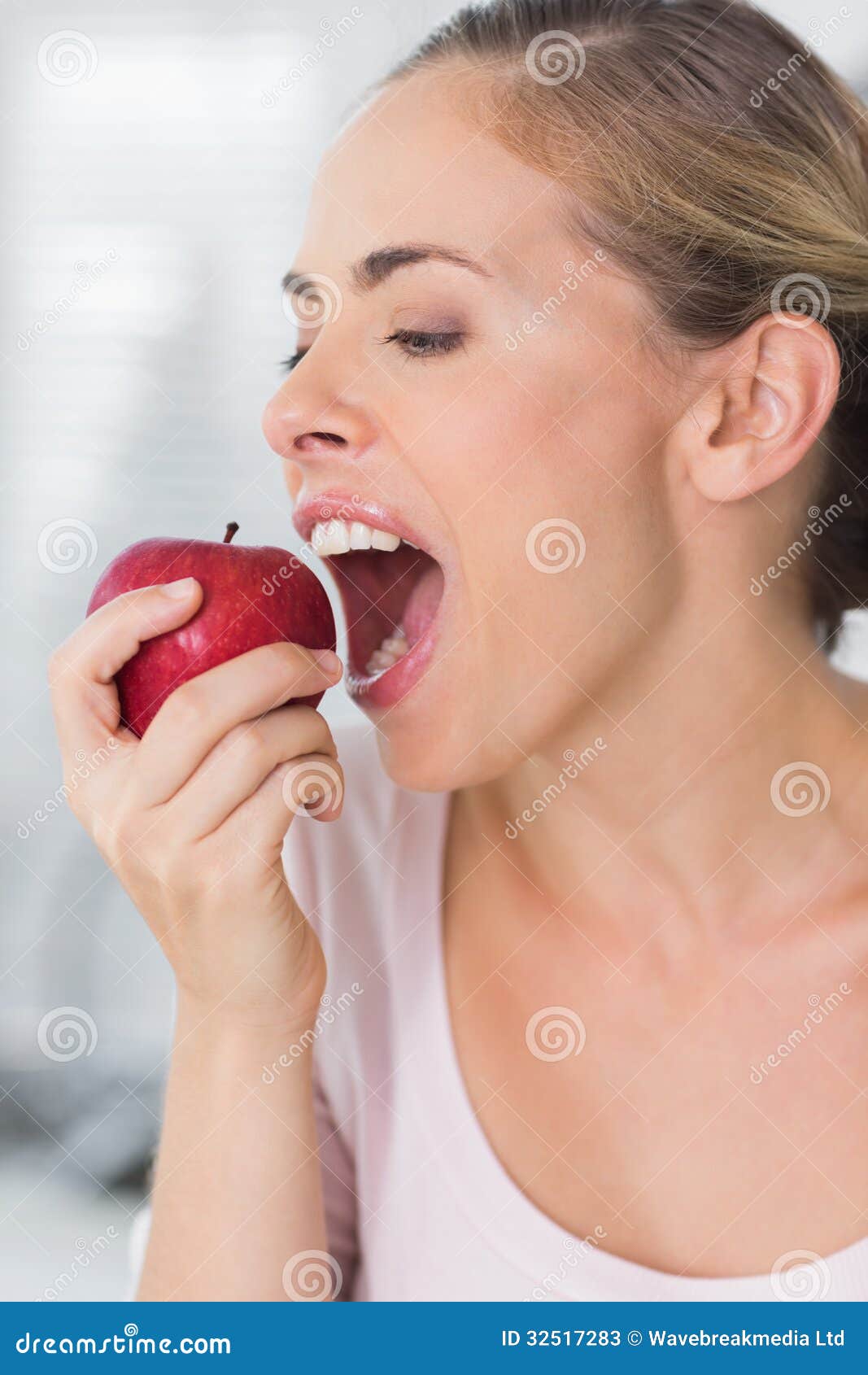Pretty Woman Munching Apple in Close Up Stock Image - Image of ...