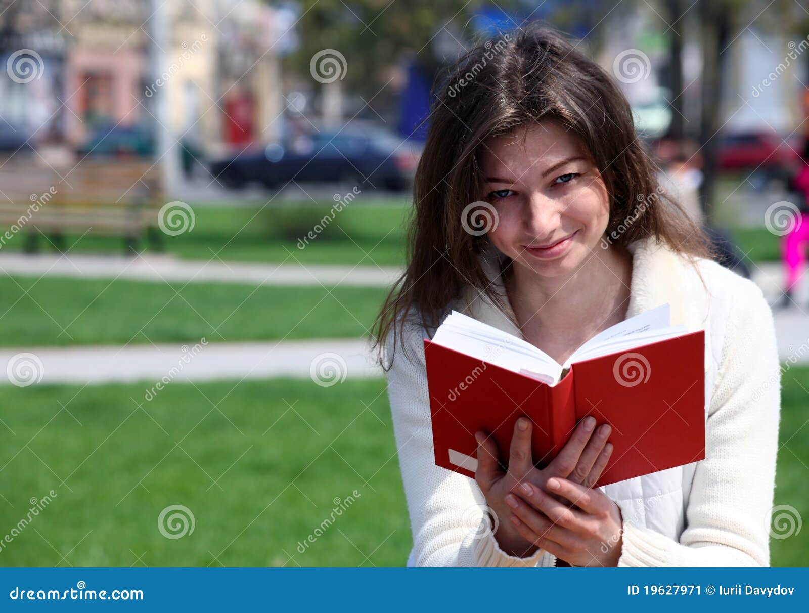 Pretty Woman in Park Reading Book and Smiling Stock Image - Image of ...