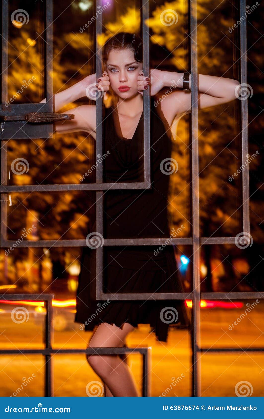 Pretty Woman Posing in Cage Outdoors at Night Stock Photo - Image of ...