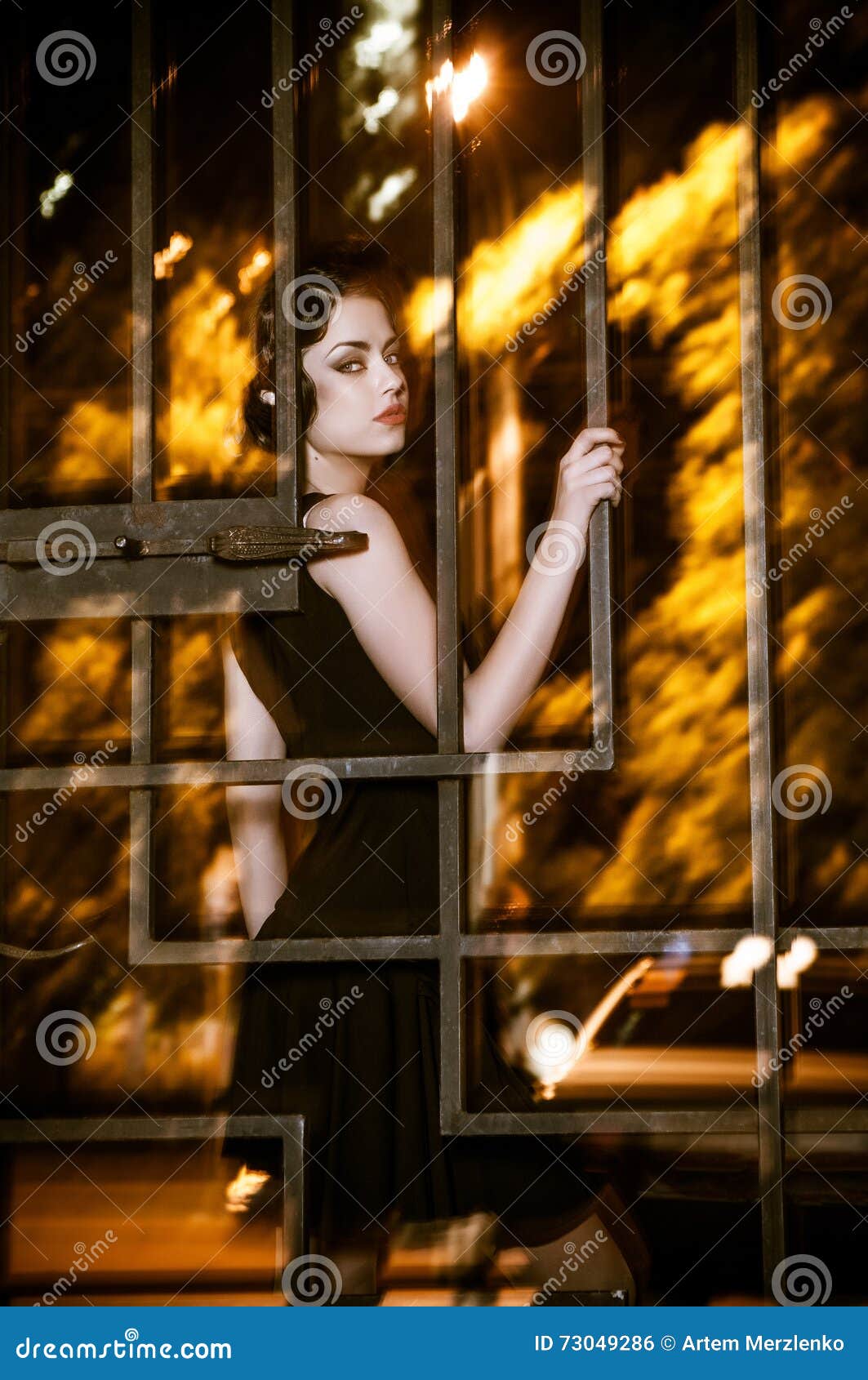 Pretty Woman Posing in Cage Outdoors at Night Stock Photo - Image of ...