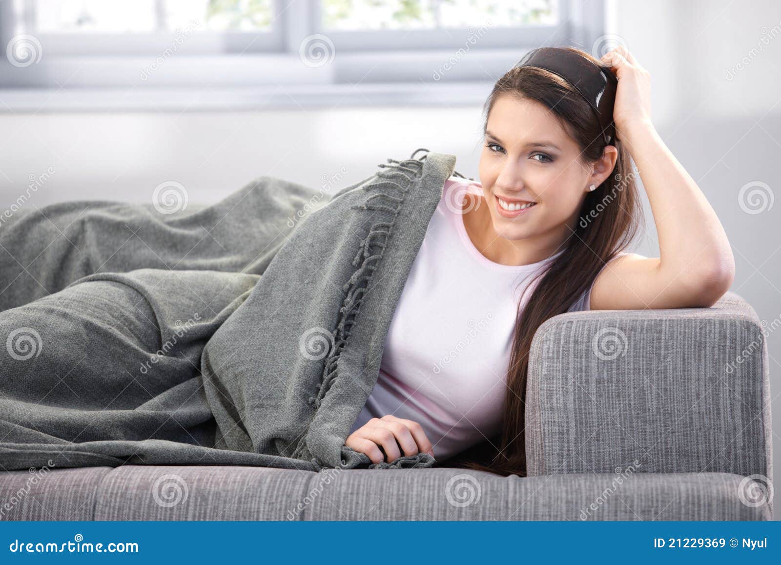 Pretty Woman Resting on Sofa Smiling Stock Image - Image of caucasian ...
