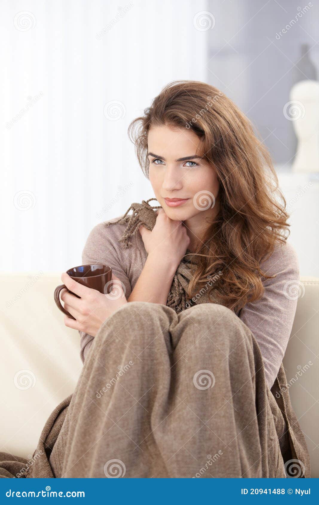 Pretty Woman Sitting on Sofa Drinking Tea Stock Photo - Image of ...