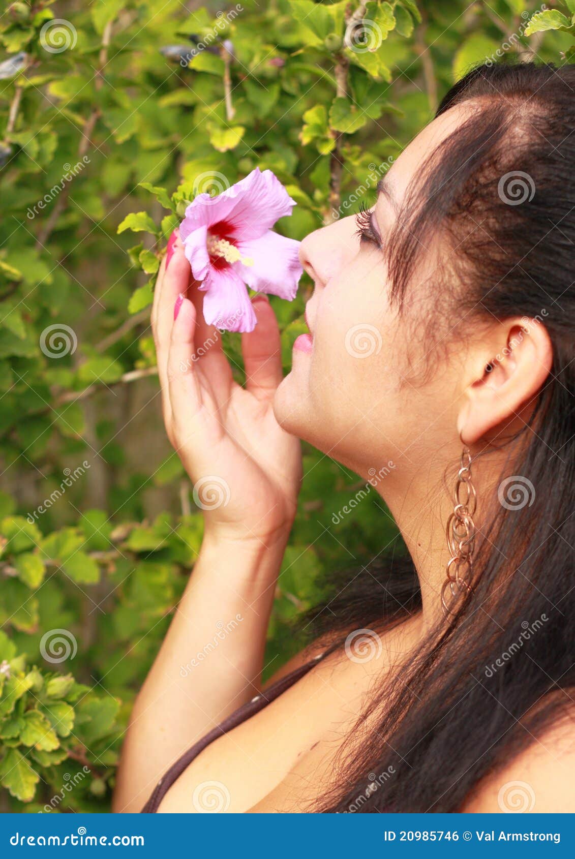 Pretty Woman Smelling Flower Stock Photo - Image of gardening, leaves ...