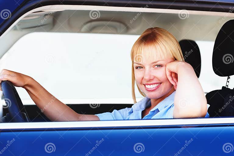 Pretty Woman Smiling From The Drivers Seat Of A Car Smiling Blond