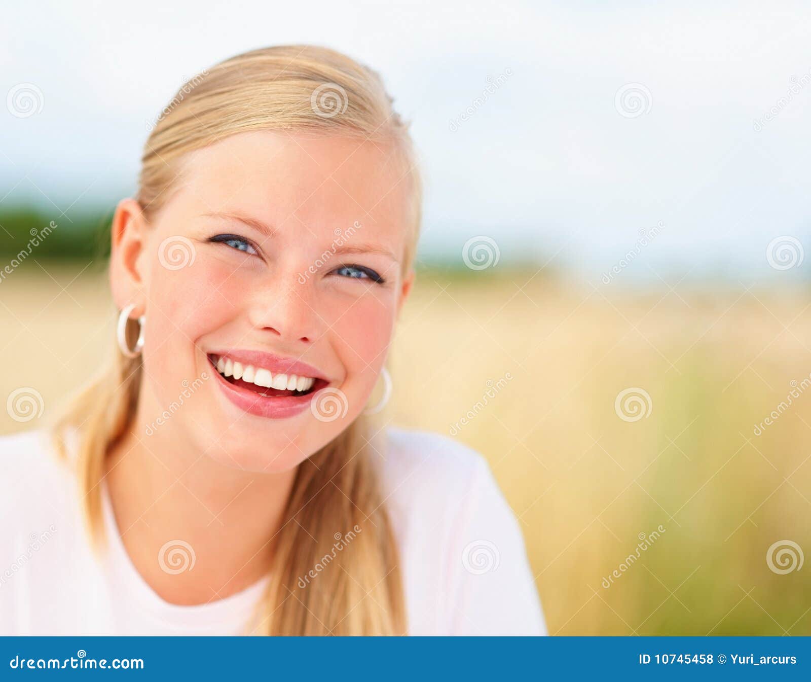 Pretty Woman Smiling at a Field Stock Photo - Image of human, carefree ...