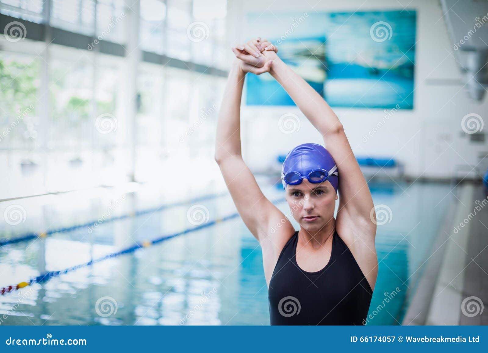 Pretty woman stretching stock image. Image of pool, focused - 66174057