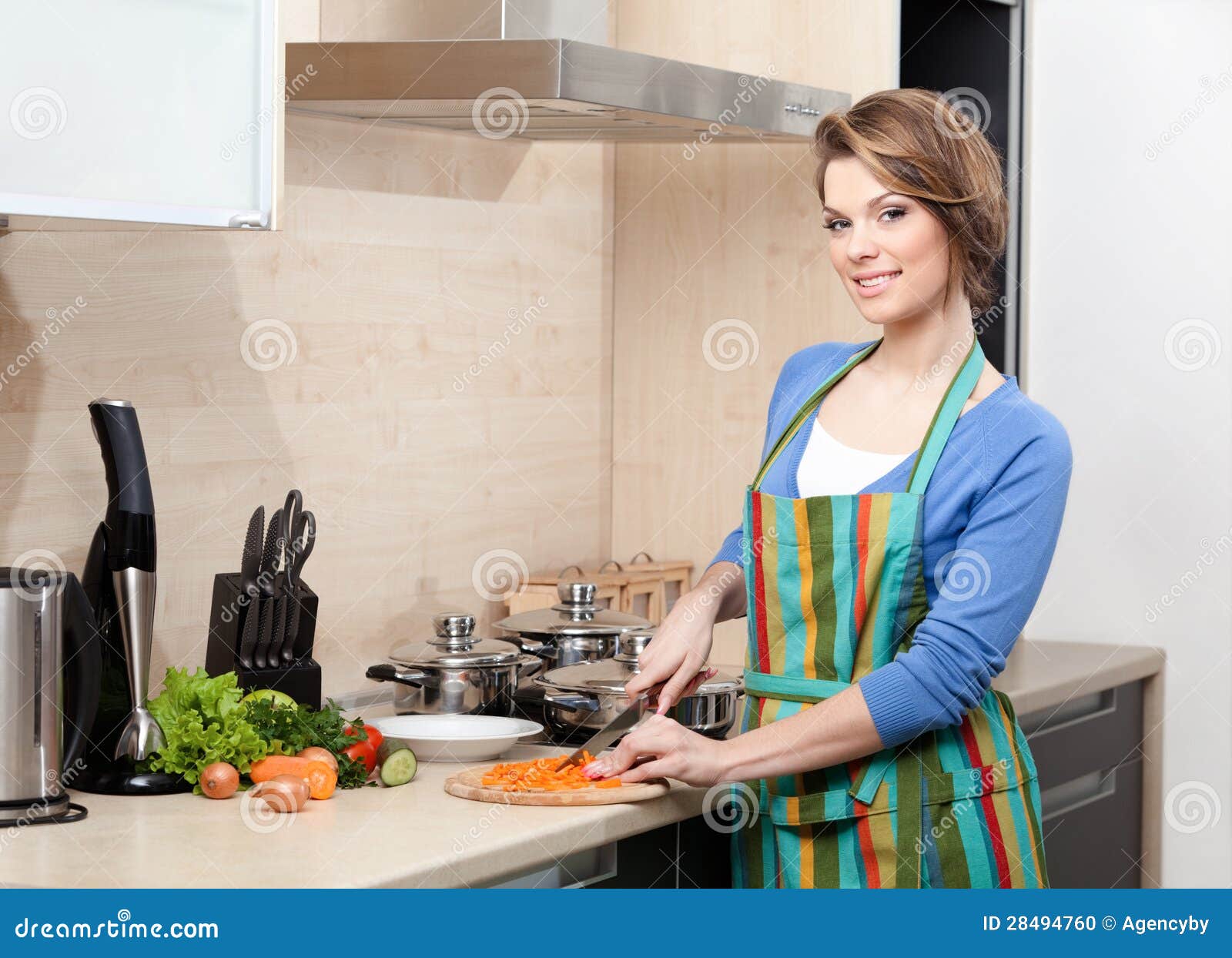Pretty Woman in Striped Apron Cooks Stock Photo - Image of cutting ...