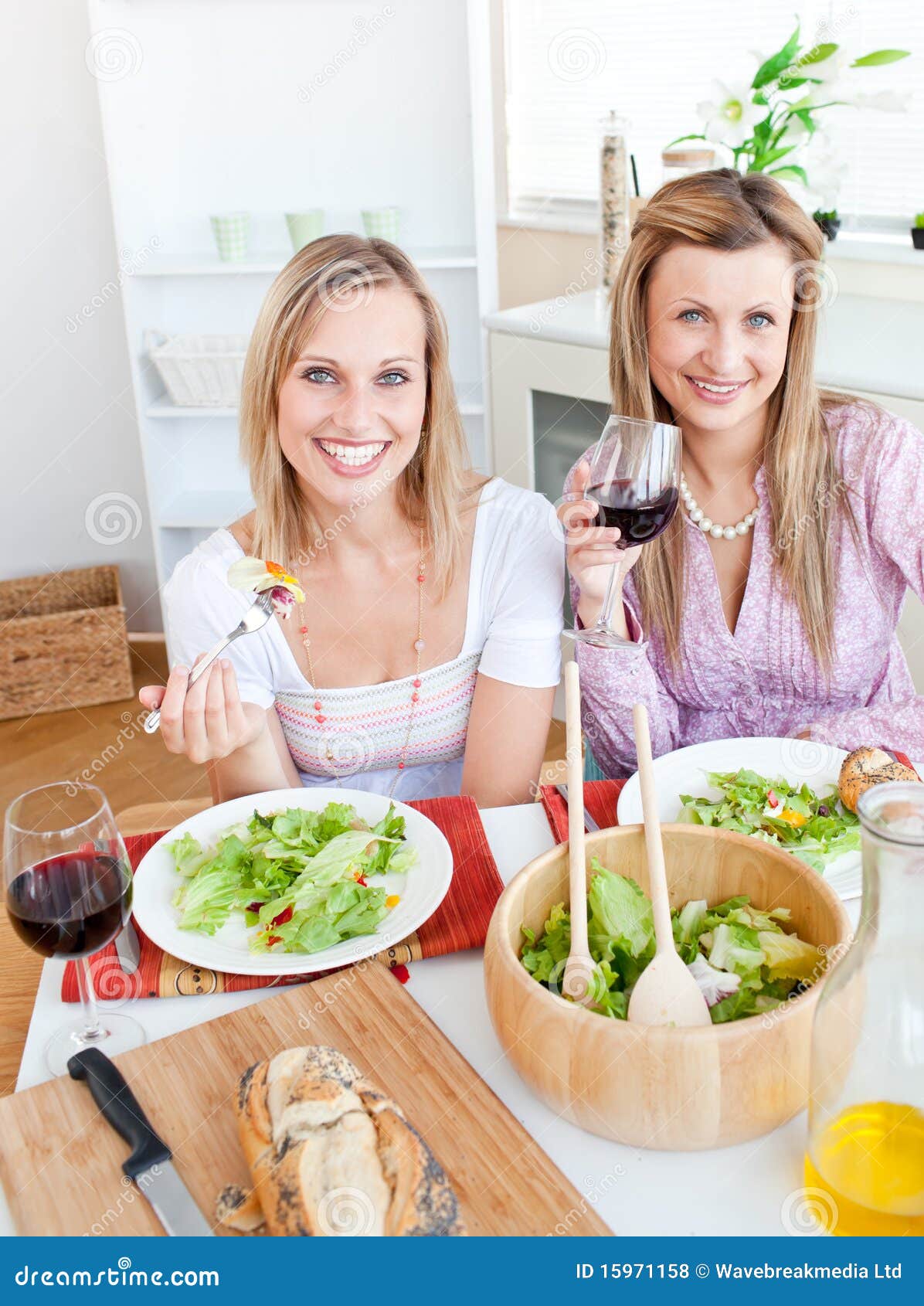Pretty Women Eating a Salad and Drinking Wine Stock Photo - Image of joyful, good: 15971158
