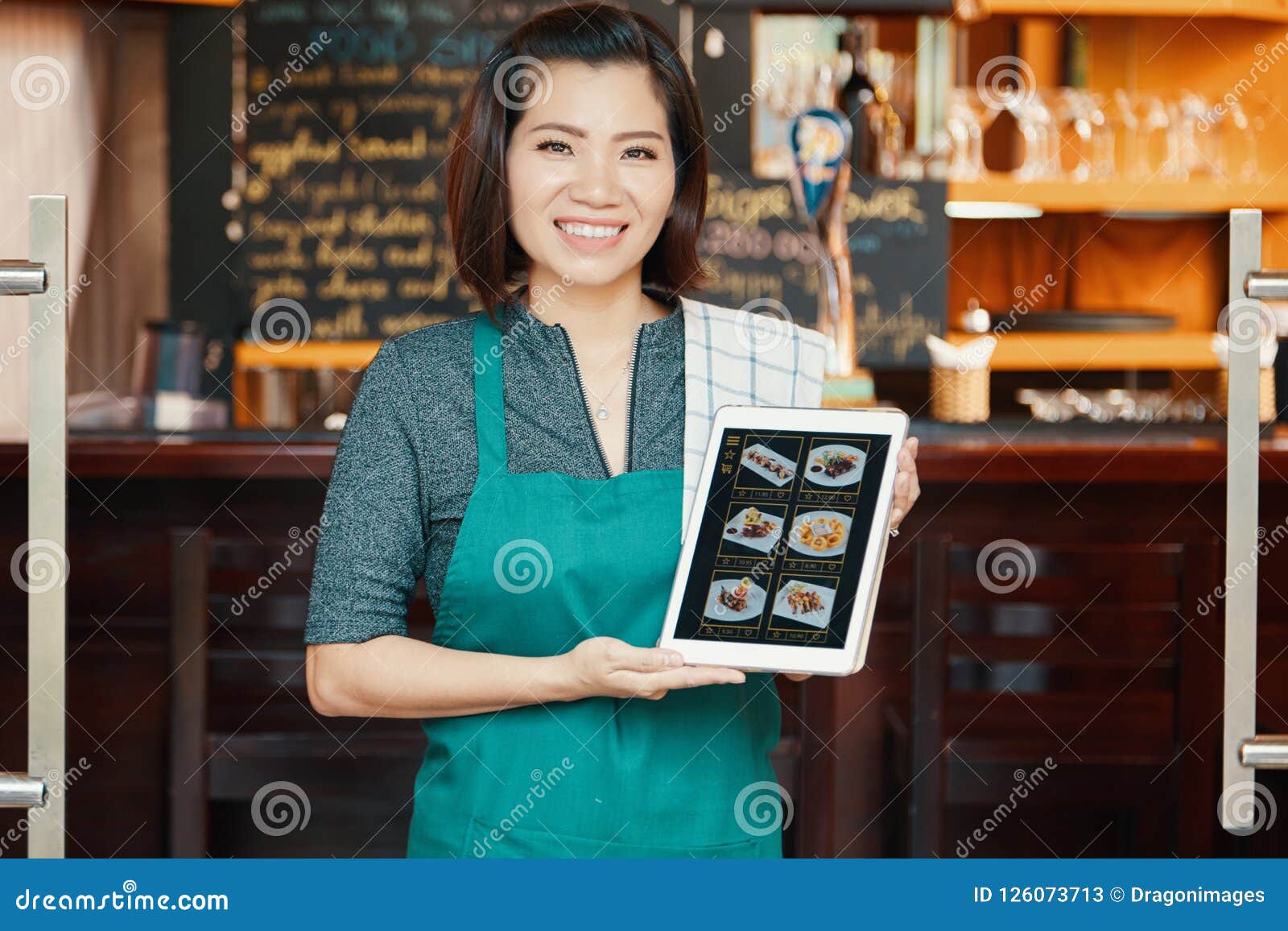 Waitress showing menu stock image. Image of cafe, attractive - 126073713